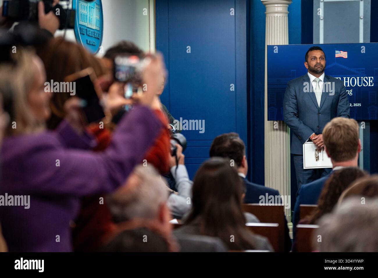 FBI Director Kash Patel looks on before speaking during a press ...