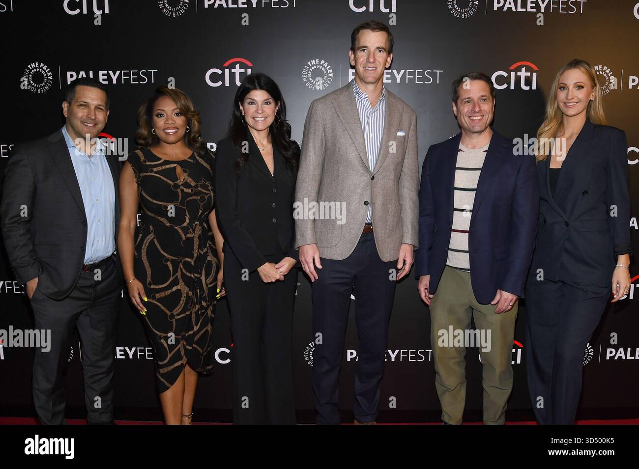 (L-R) Adam Schefter, Kimberley A. Martin, Maureen J. Reidy, Eli Manning ...