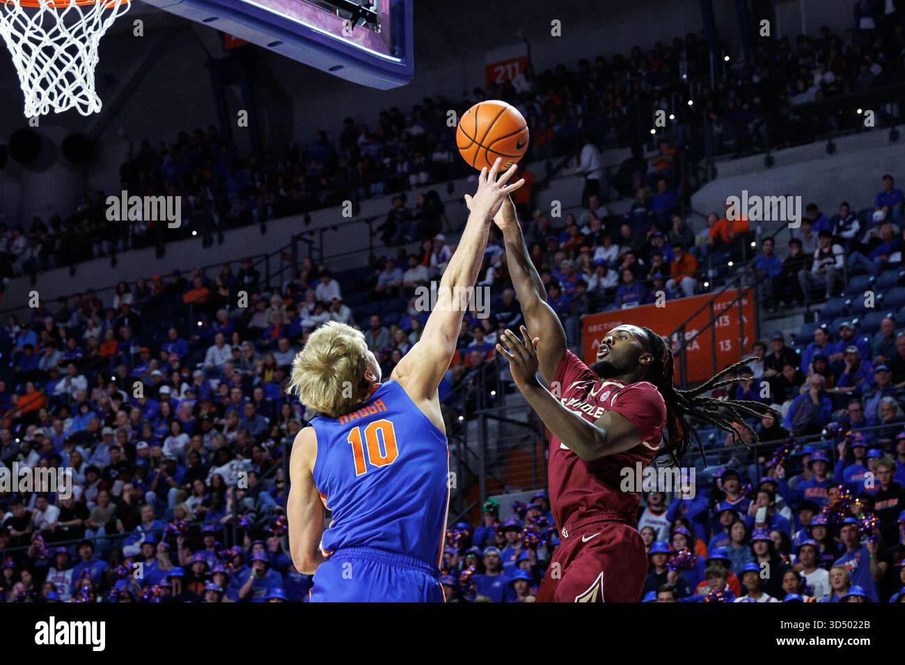 Florida State guard Robert McCray V, right, shoots over Florida forward ...