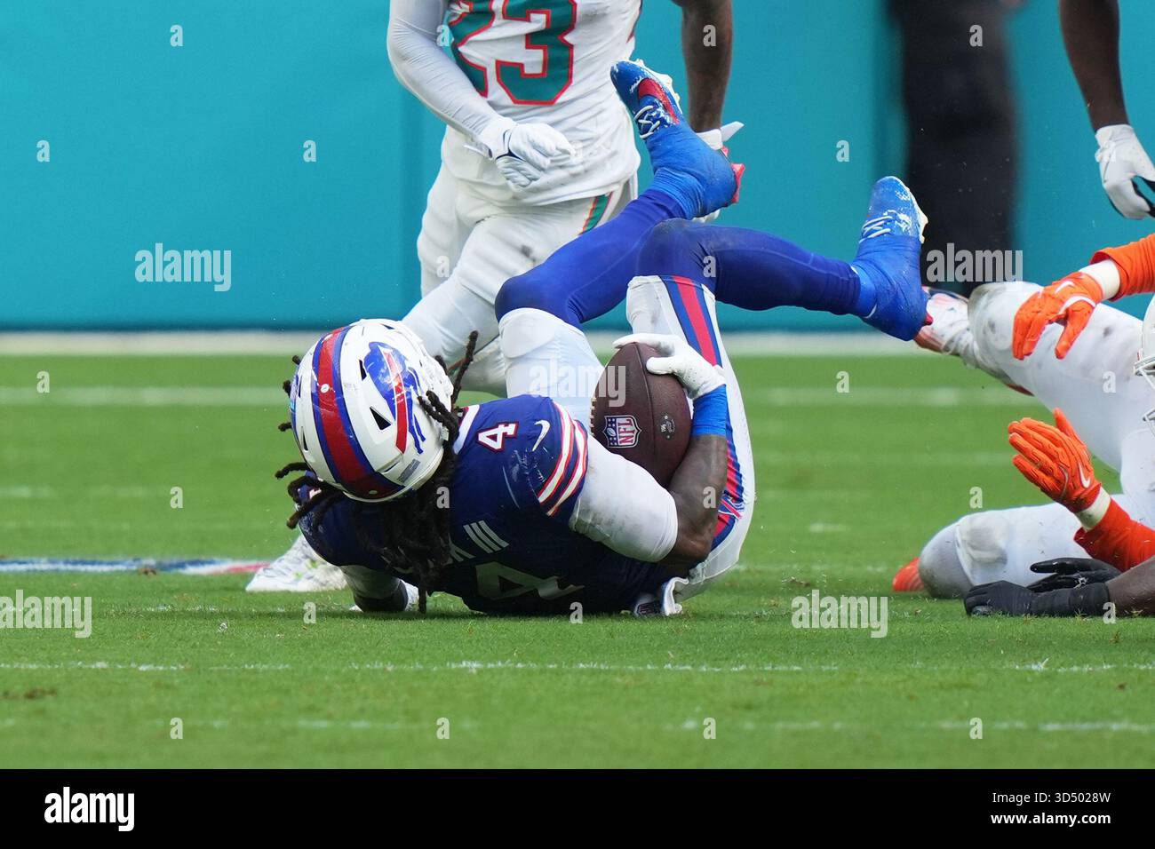 Buffalo Bills running back James Cook (4) is tackled during the second ...