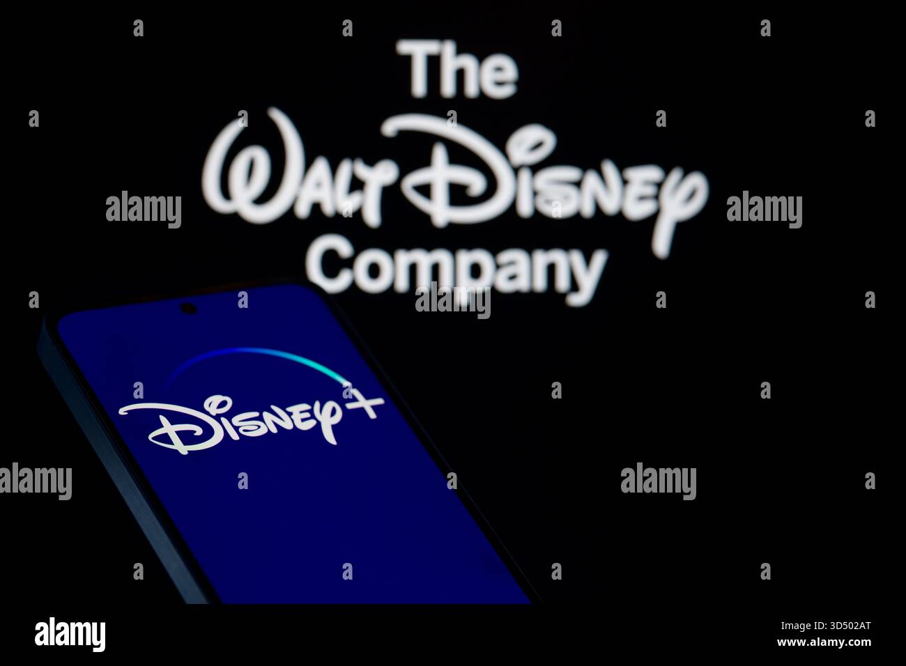 The Disney Plus logo is displayed on a mobile phone with the company ...
