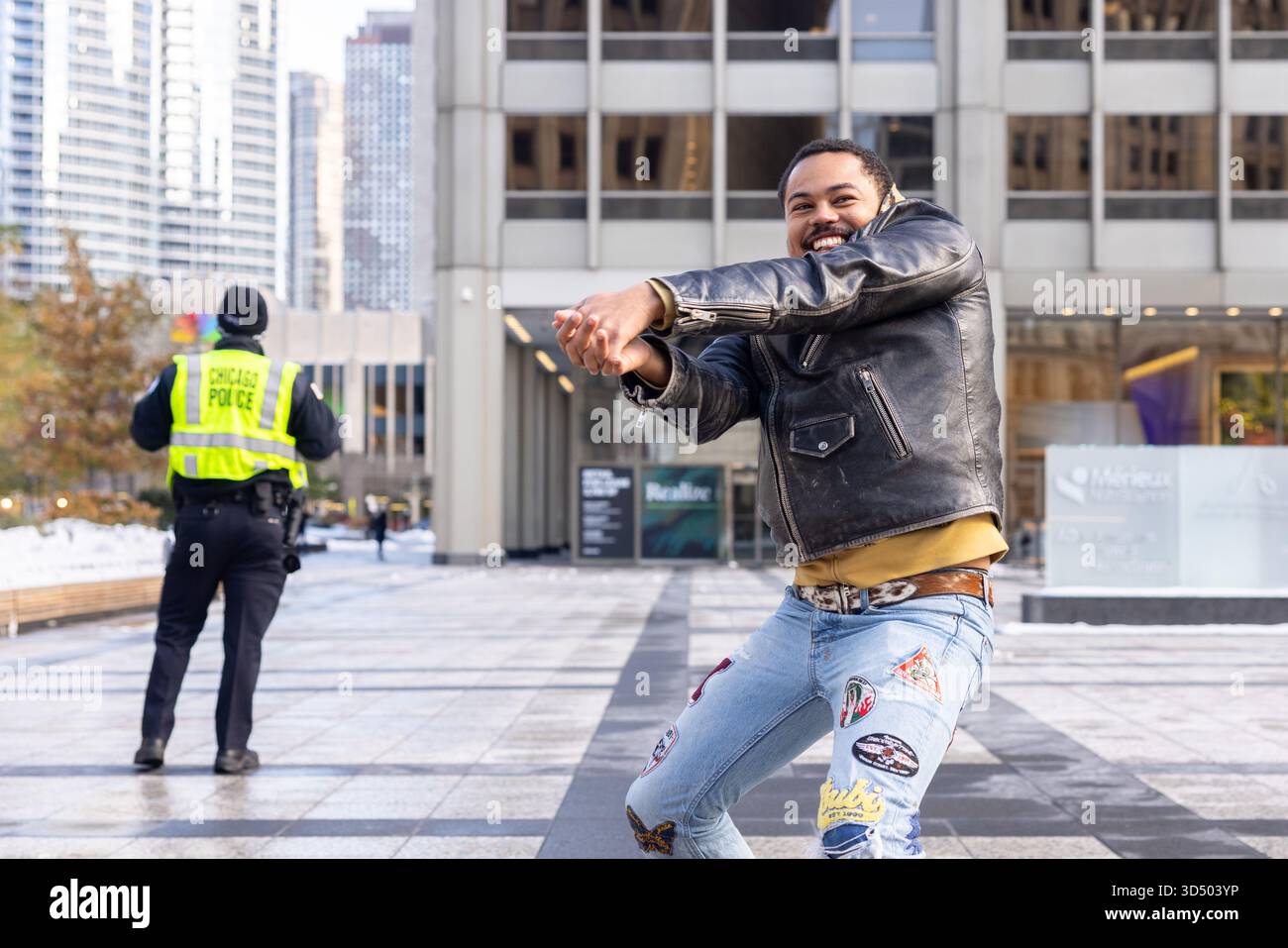 Chicago rapper Adamn Killa films a TikTok in front of a CPD officer in ...