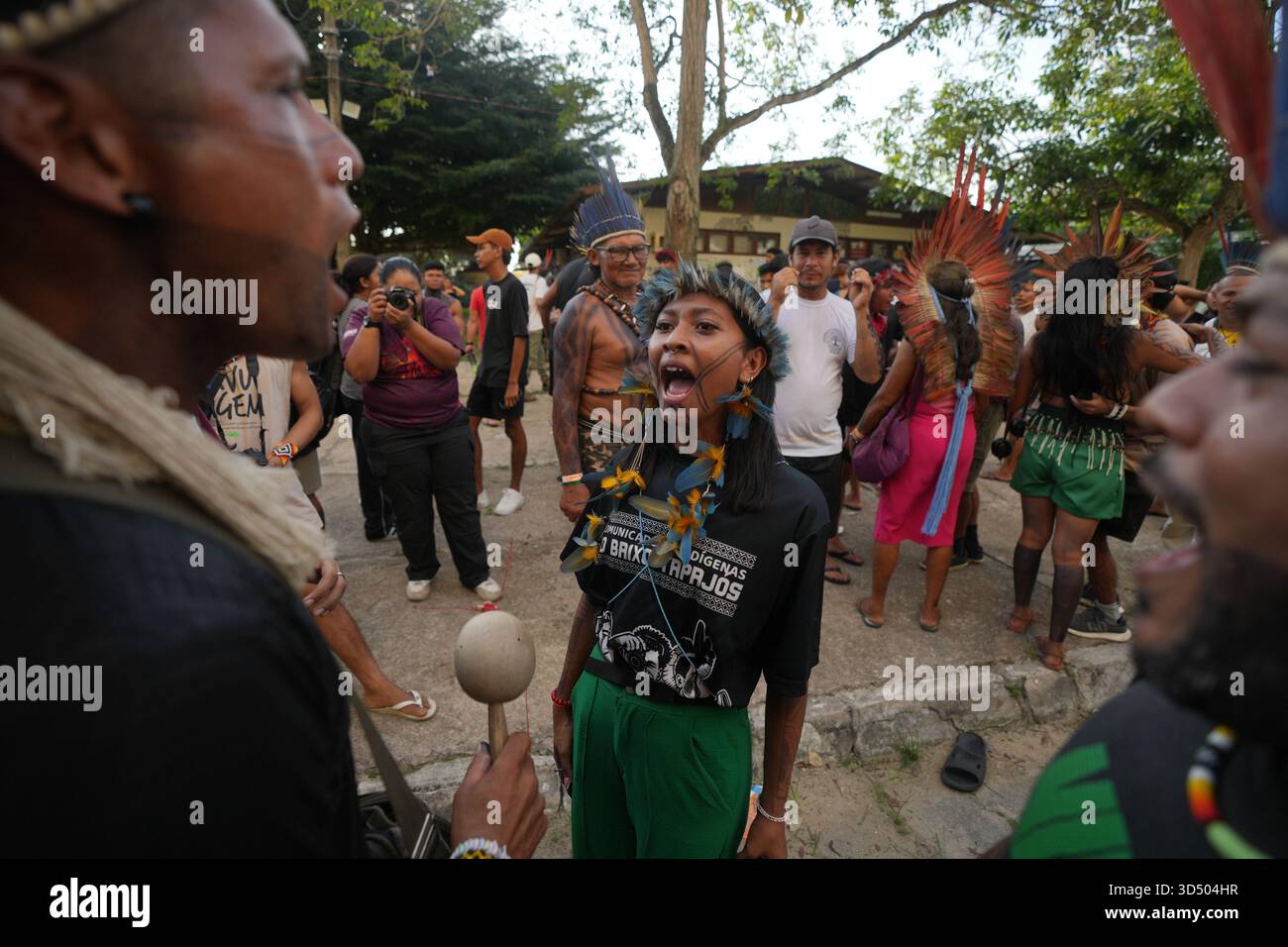 Indigenous peoples participate in an opening ceremony as part of the ...