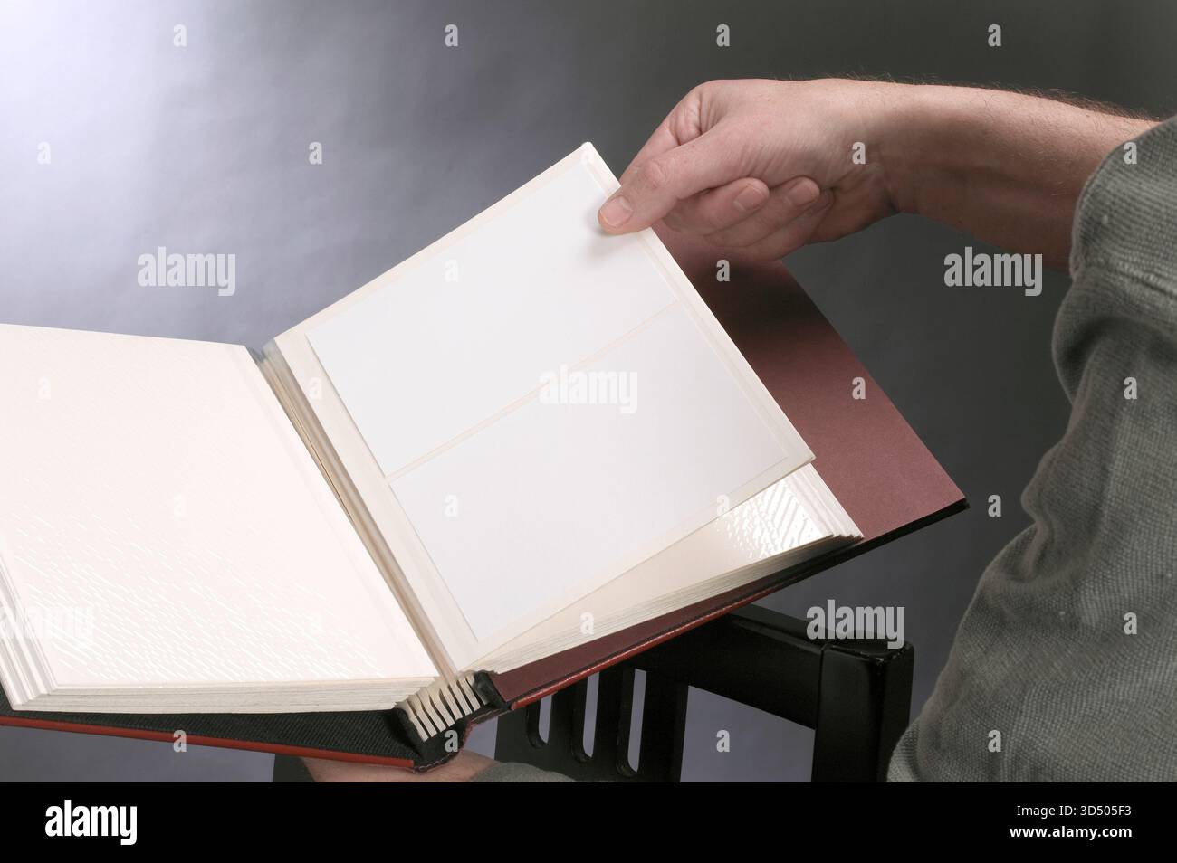 Hand holding book three hi-res stock photography and images - Alamy