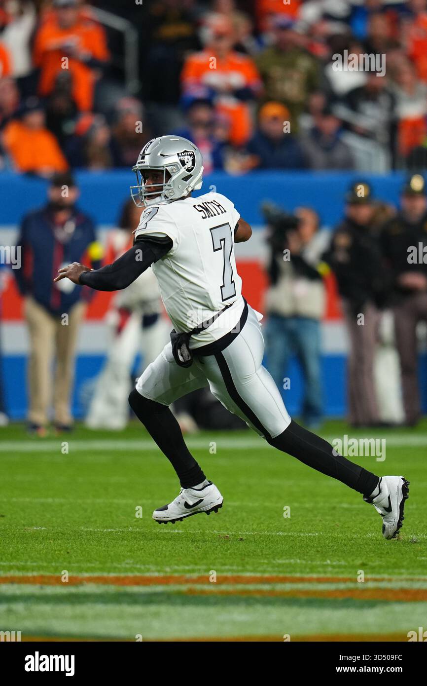 Las Vegas Raiders quarterback Geno Smith scrambles against the Denver ...