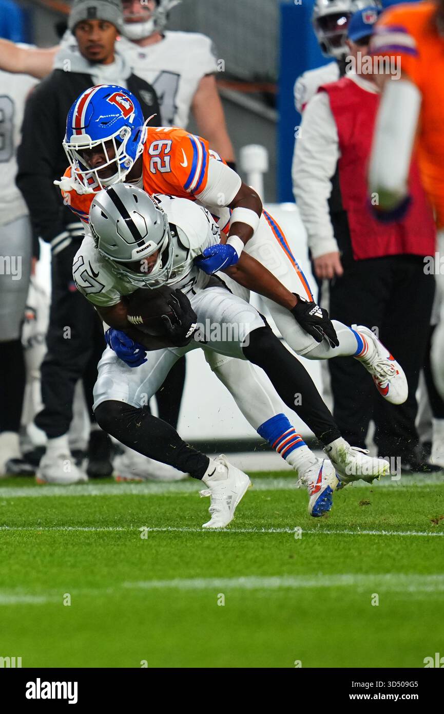 Las Vegas Raiders wide receiver Tyler Lockett (17) is tackled by Denver ...
