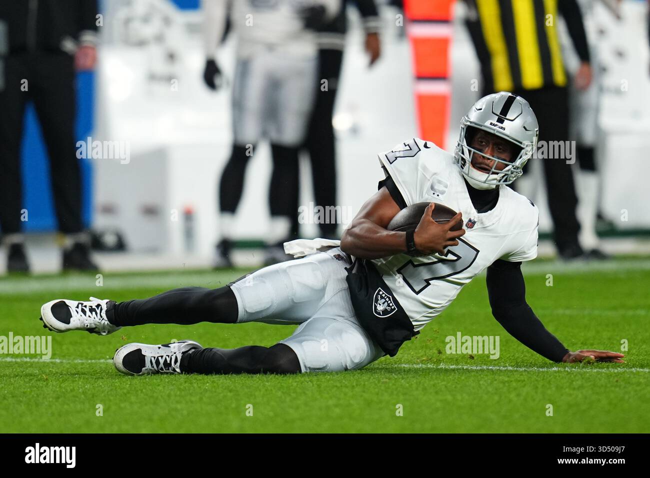 Las Vegas Raiders quarterback Geno Smith scrambles against the Denver ...