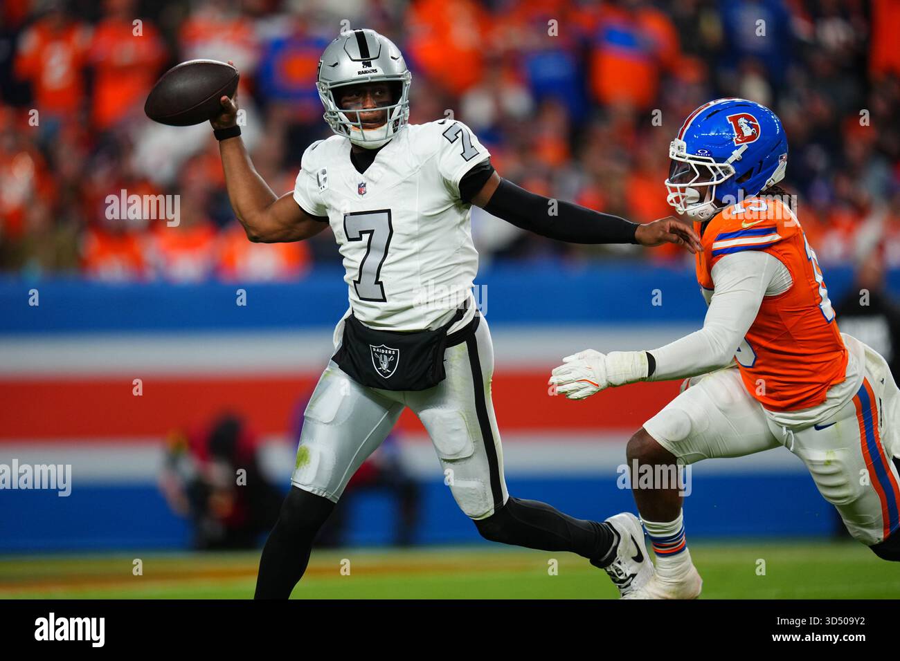 Las Vegas Raiders quarterback Geno Smith (7) throws under pressure from ...
