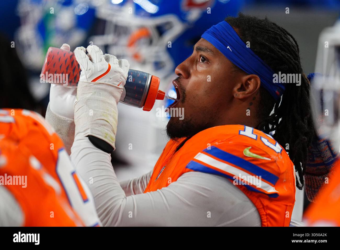 Denver Broncos linebacker Nik Bonitto (15) takes a drink against the ...