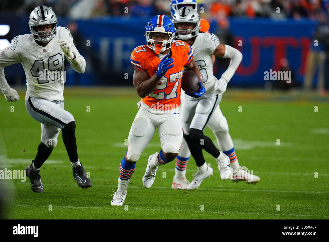 Denver Broncos running back J.K. Dobbins (27) runs against the Las ...