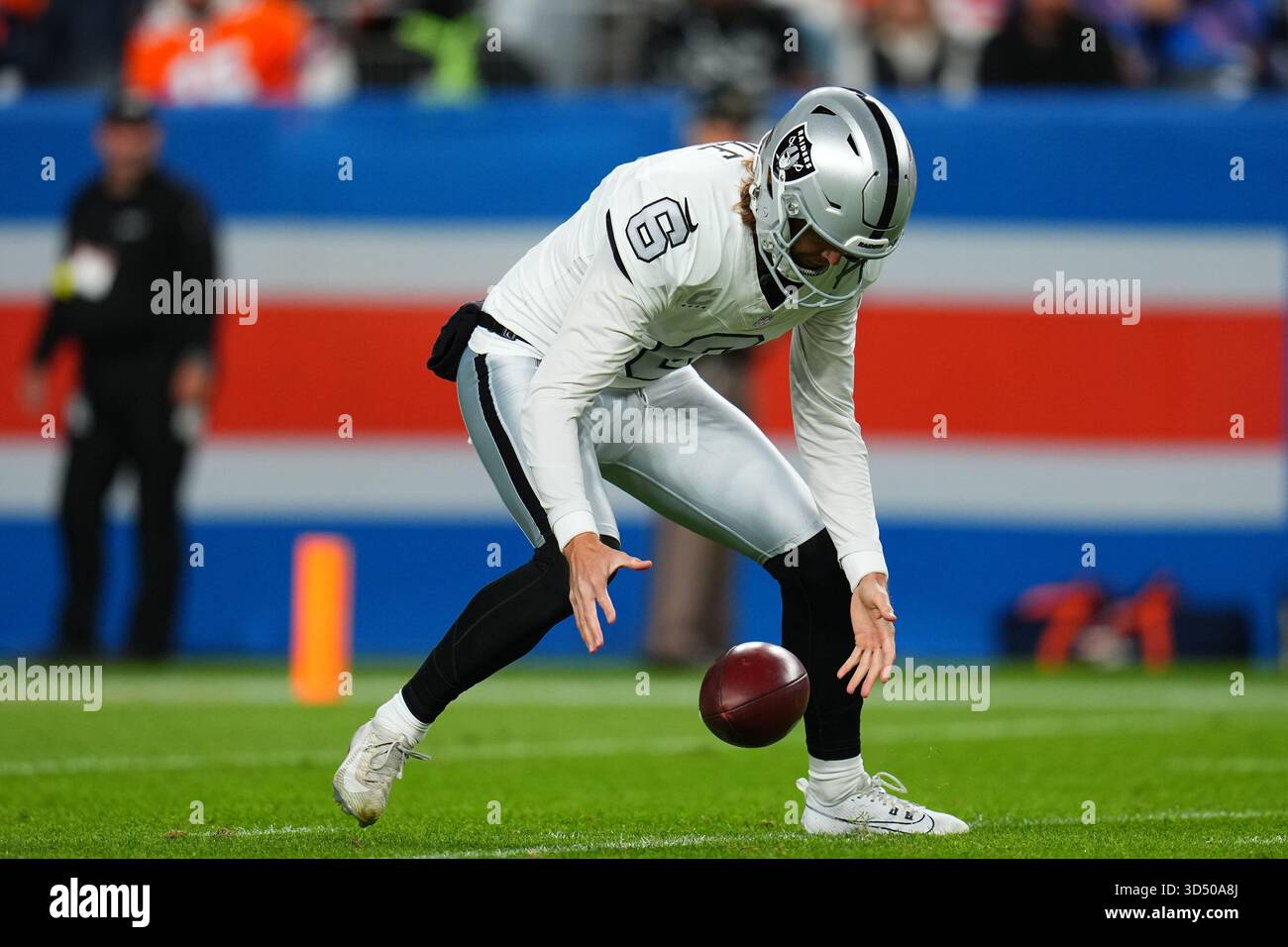 Las Vegas Raiders punter AJ Cole drops the ball snap kick against the ...