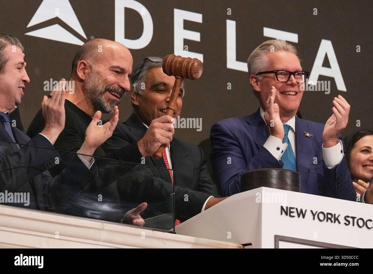 Uber CEO Dara Khosrowshahi, left, gavels trading closed as Delta Air ...