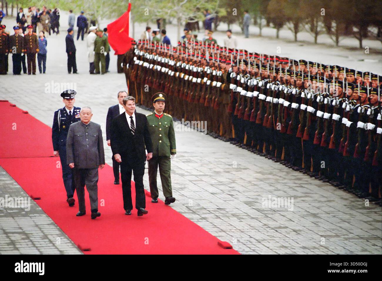 U.S. President Ronald Reagan reviewing Chinese troops during arrival ...