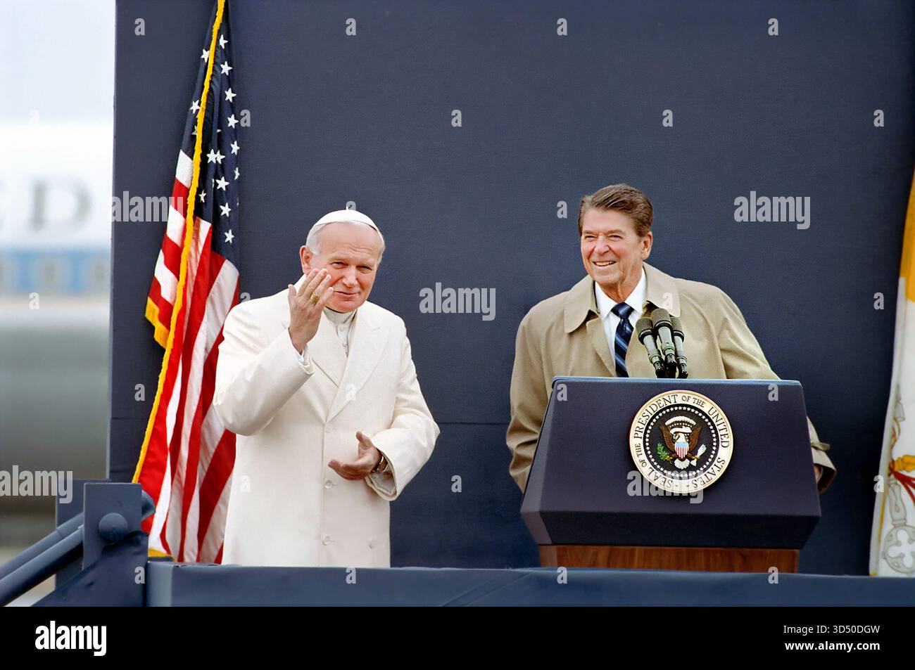 U.S. President Ronald Reagan and Pope John Paul II standing at podium ...
