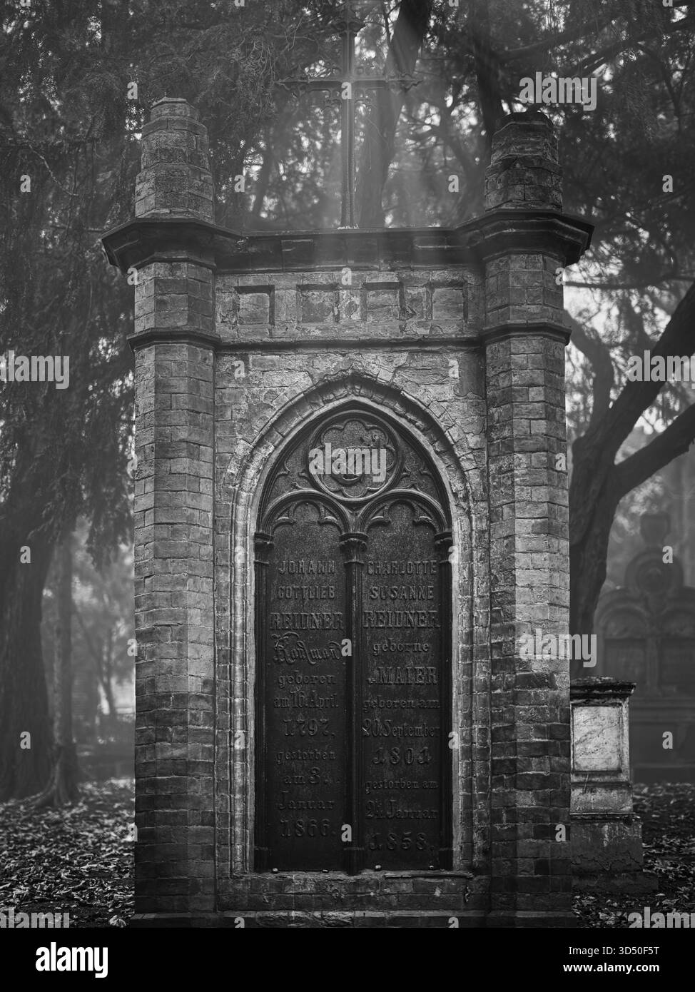 Black and white view of a historic gothic tomb with stone arch and ...