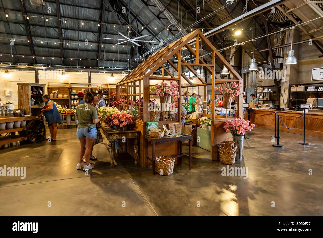 A flower stand inside Magnolia Market at the Silos in Waco, Texas, USA ...