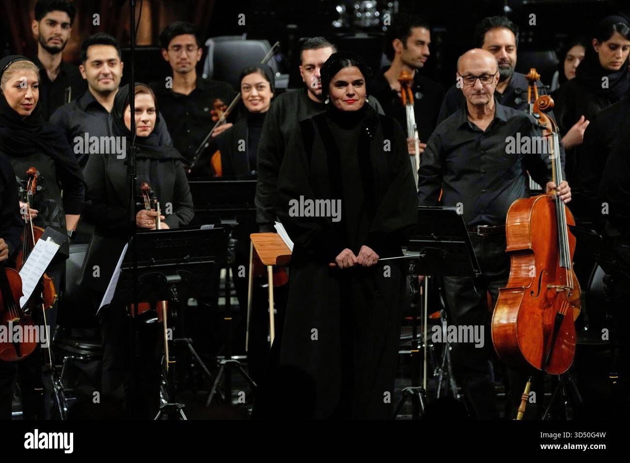 Iranian conductor and composer Paniz Faryousefi, center, and members of ...