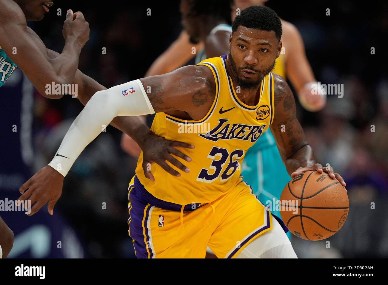 Los Angeles Lakers guard Marcus Smart brings the ball down court ...