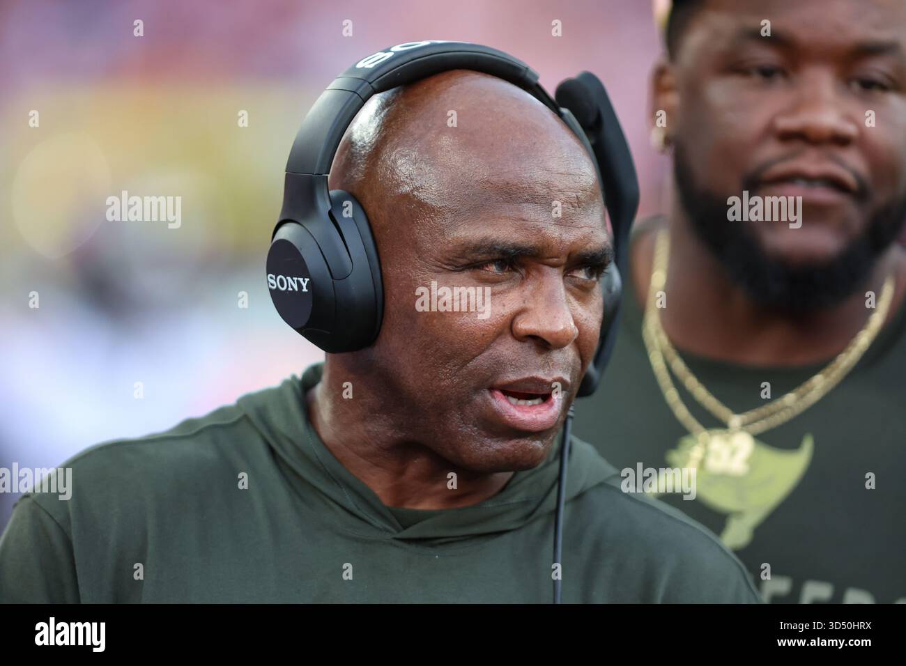 Tampa Bay Buccaneers defensive line coach Charlie Strong walks the ...