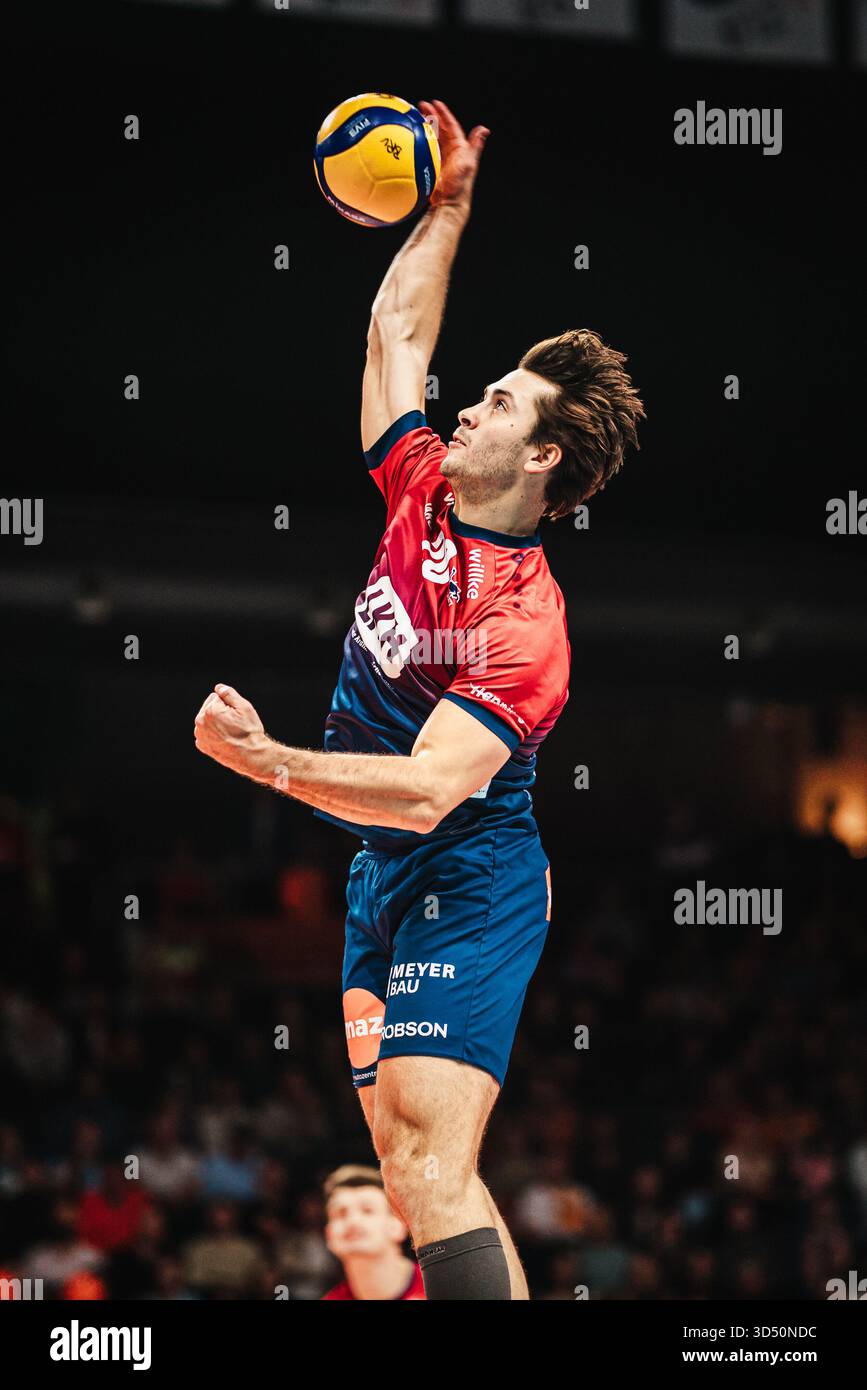 Ethan Champlin (SVG Lüneburg, 20) hits the ball; Volleyball Bundesliga ...