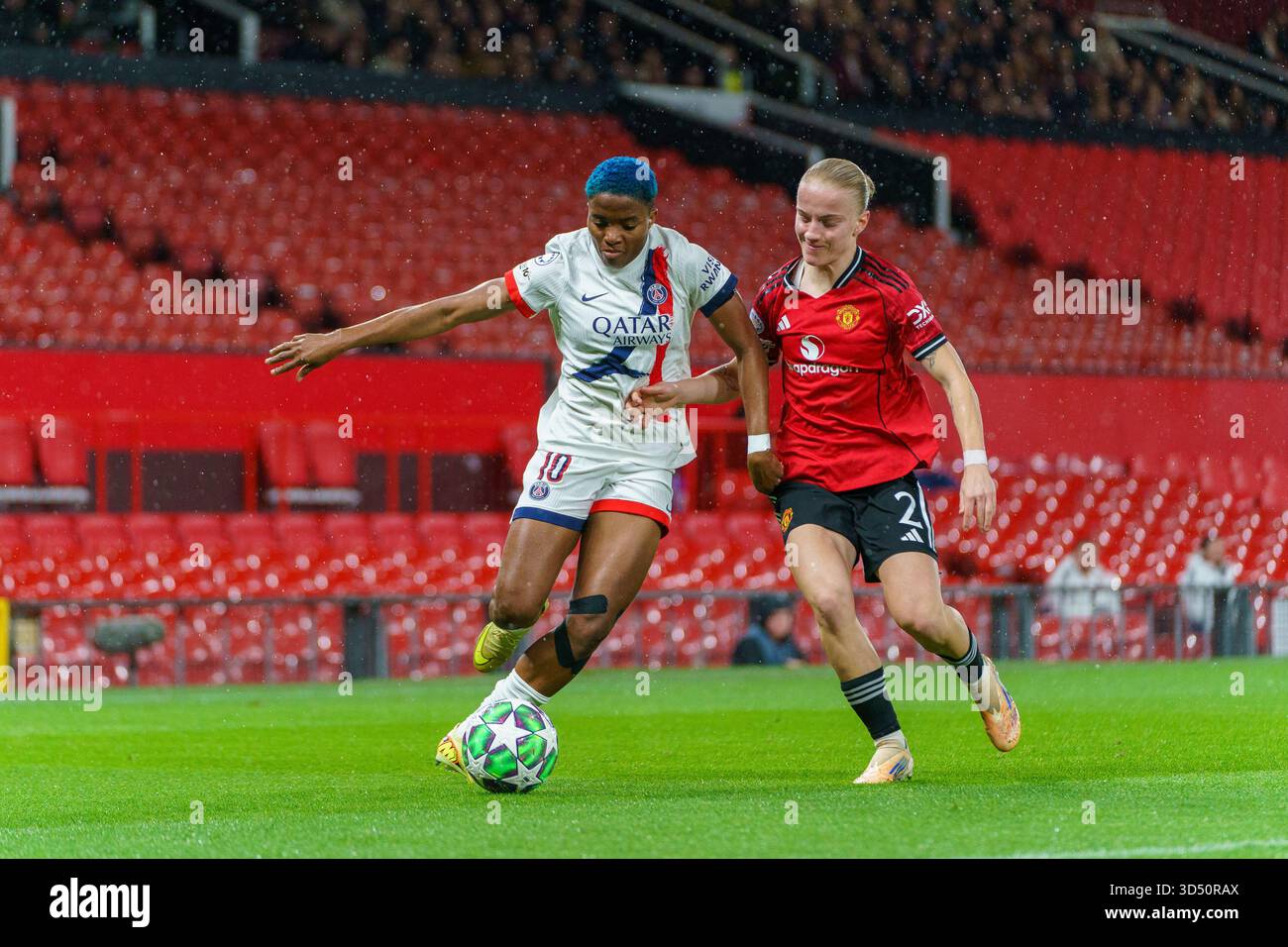 Manchester, UK, 12th Nov 2025: PSG’s Rasheedat Ajibade (left) holds off ...