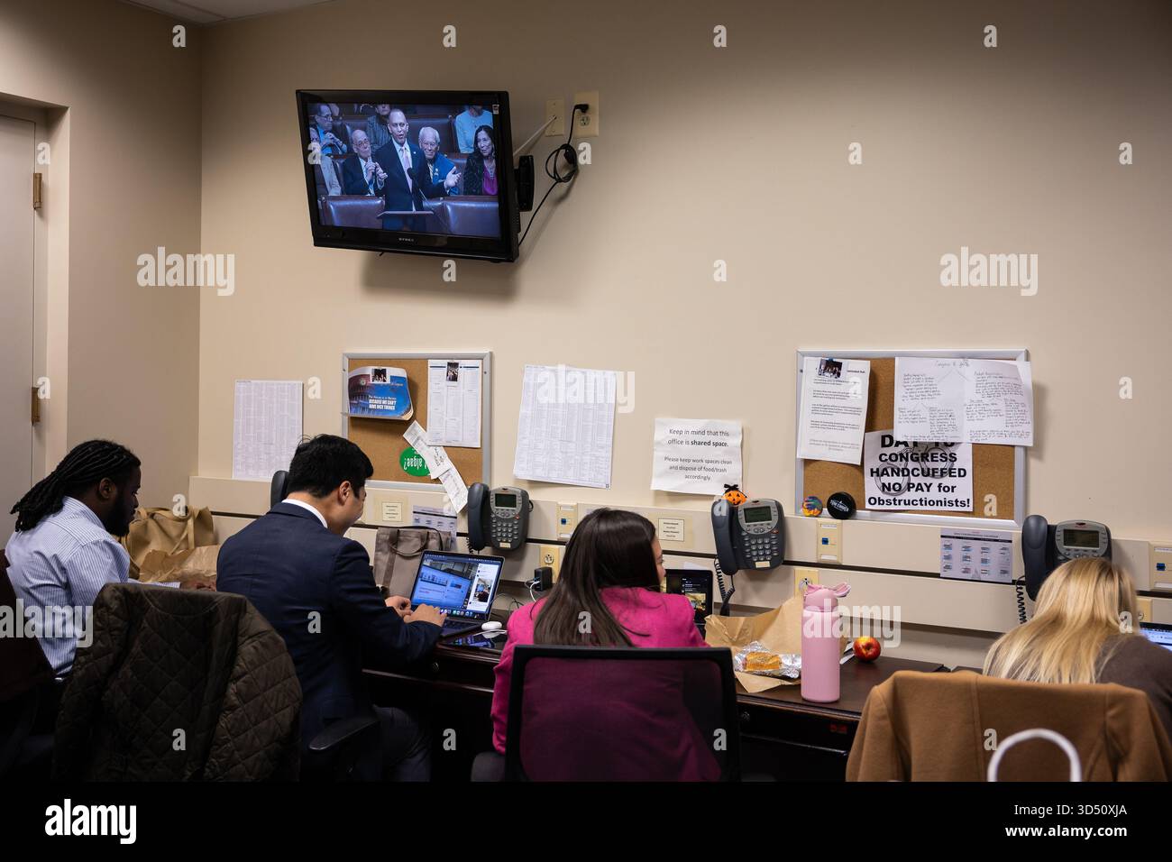 POLITICO reporters are seen in a media workroom in at the U.S. Capitol ...
