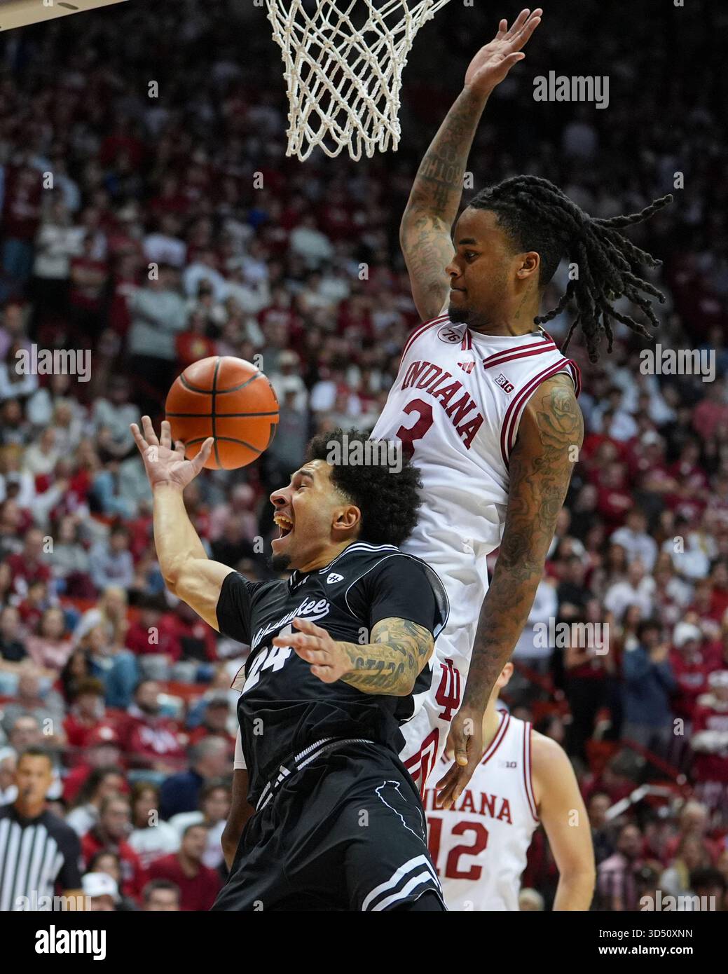 Milwaukee guard Esyah Pippa-White (24) shoots under Indiana guard Lamar ...