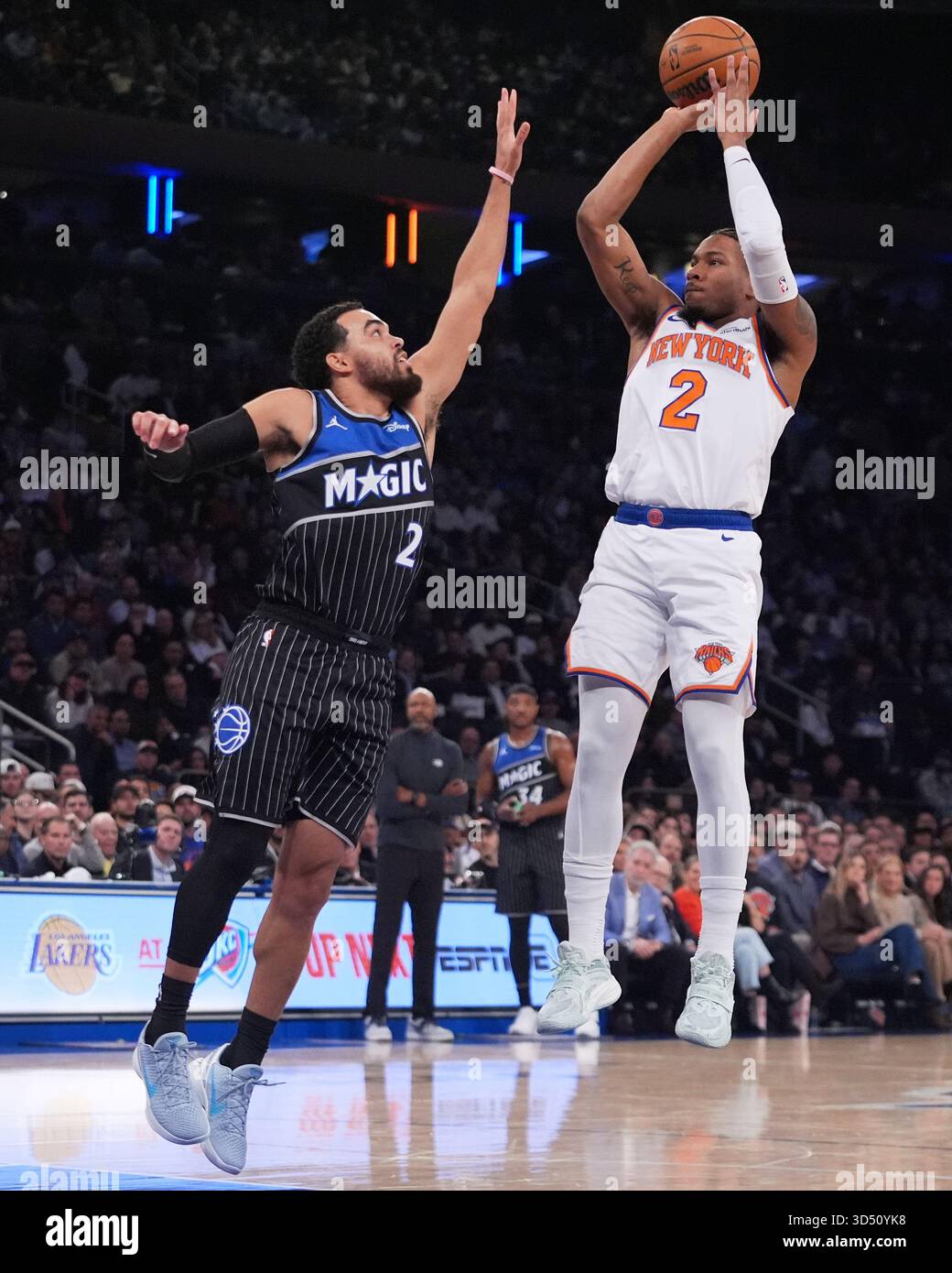 New York Knicks' Miles McBride (2) shoots over Orlando Magic's Tyus ...