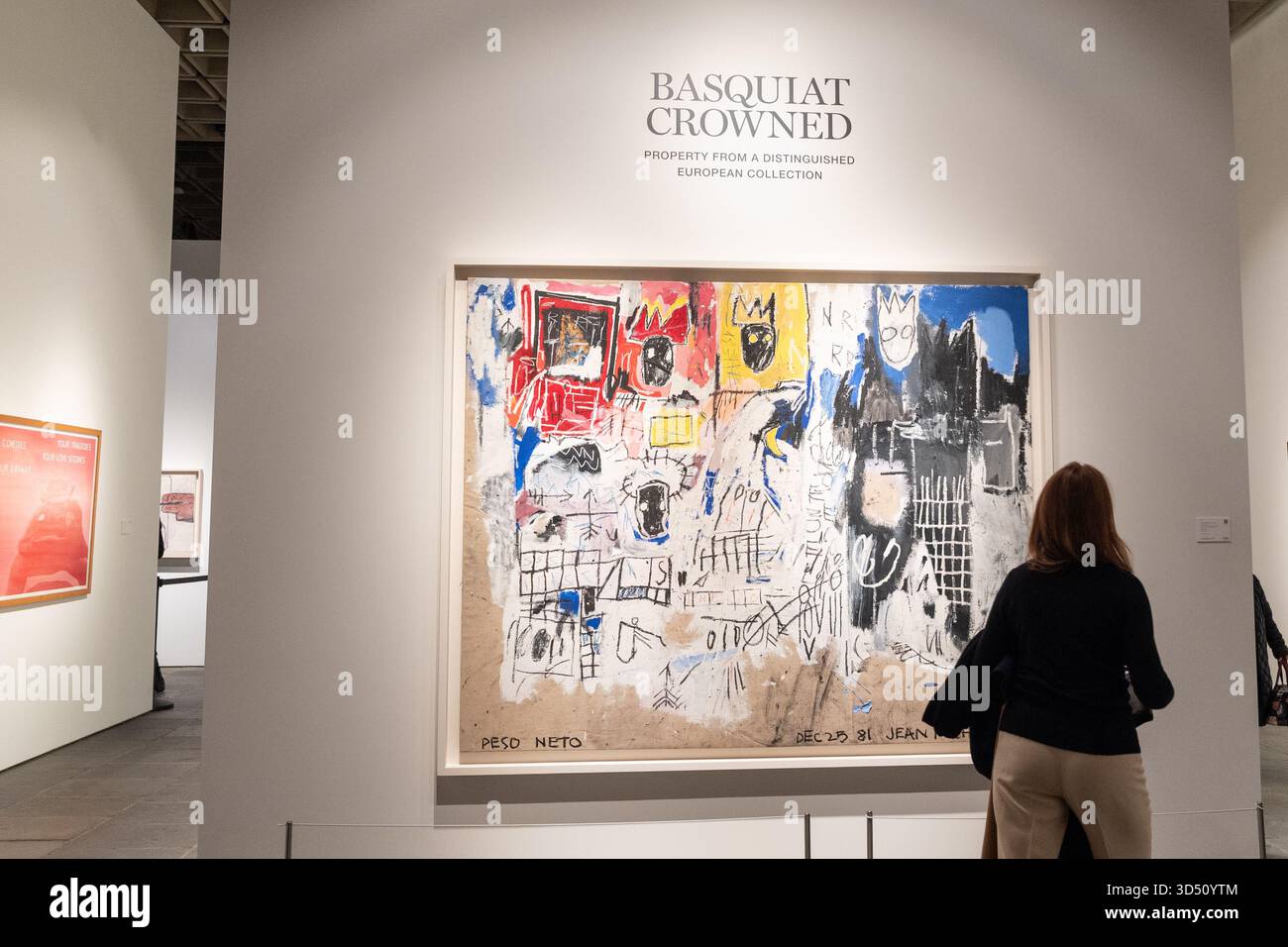 People examine Crowns (Peso Neto) by Jean-Michel Basquiat at Sotheby's ...