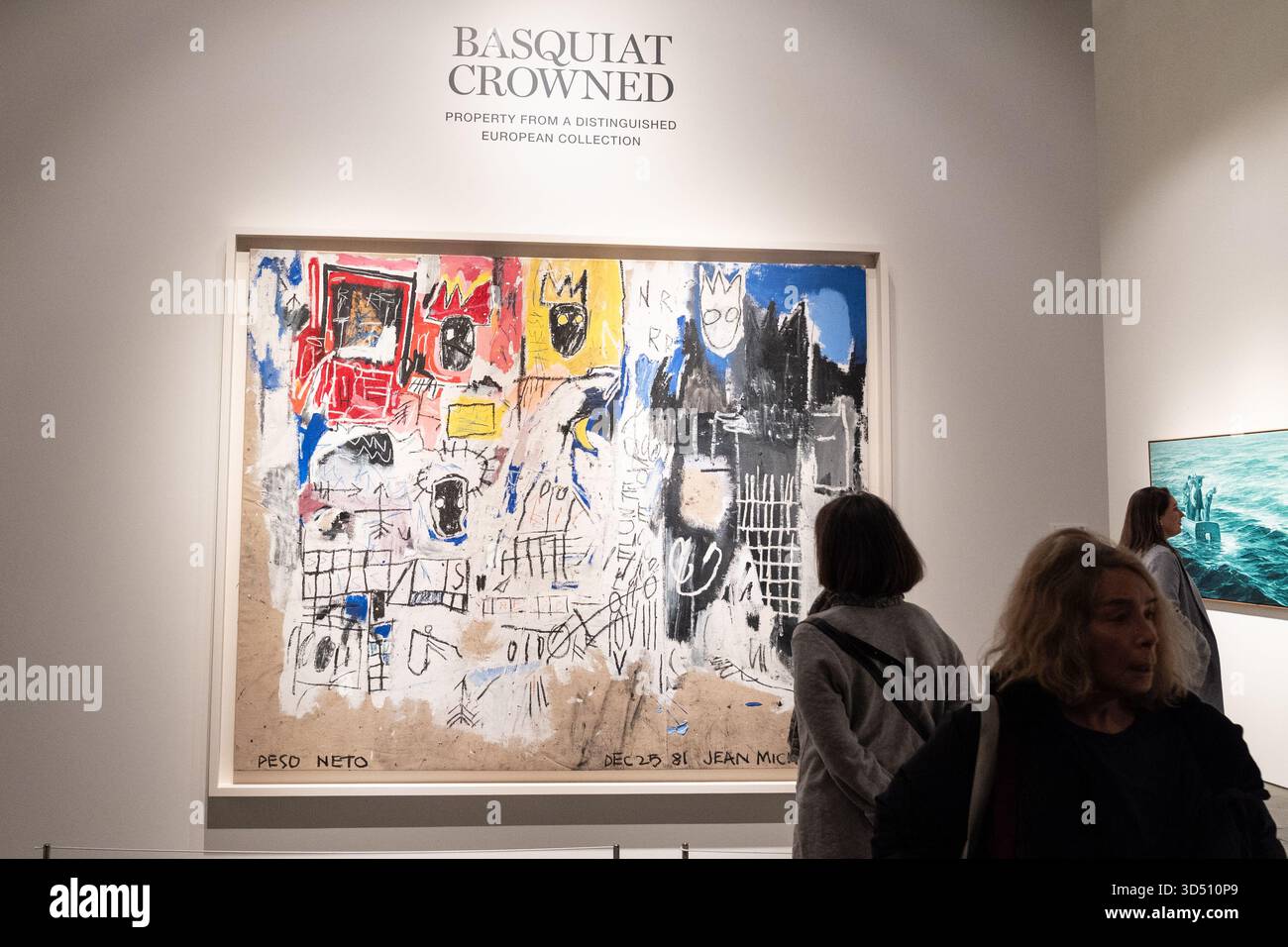 People examine Crowns (Peso Neto) by Jean-Michel Basquiat at Sotheby's ...