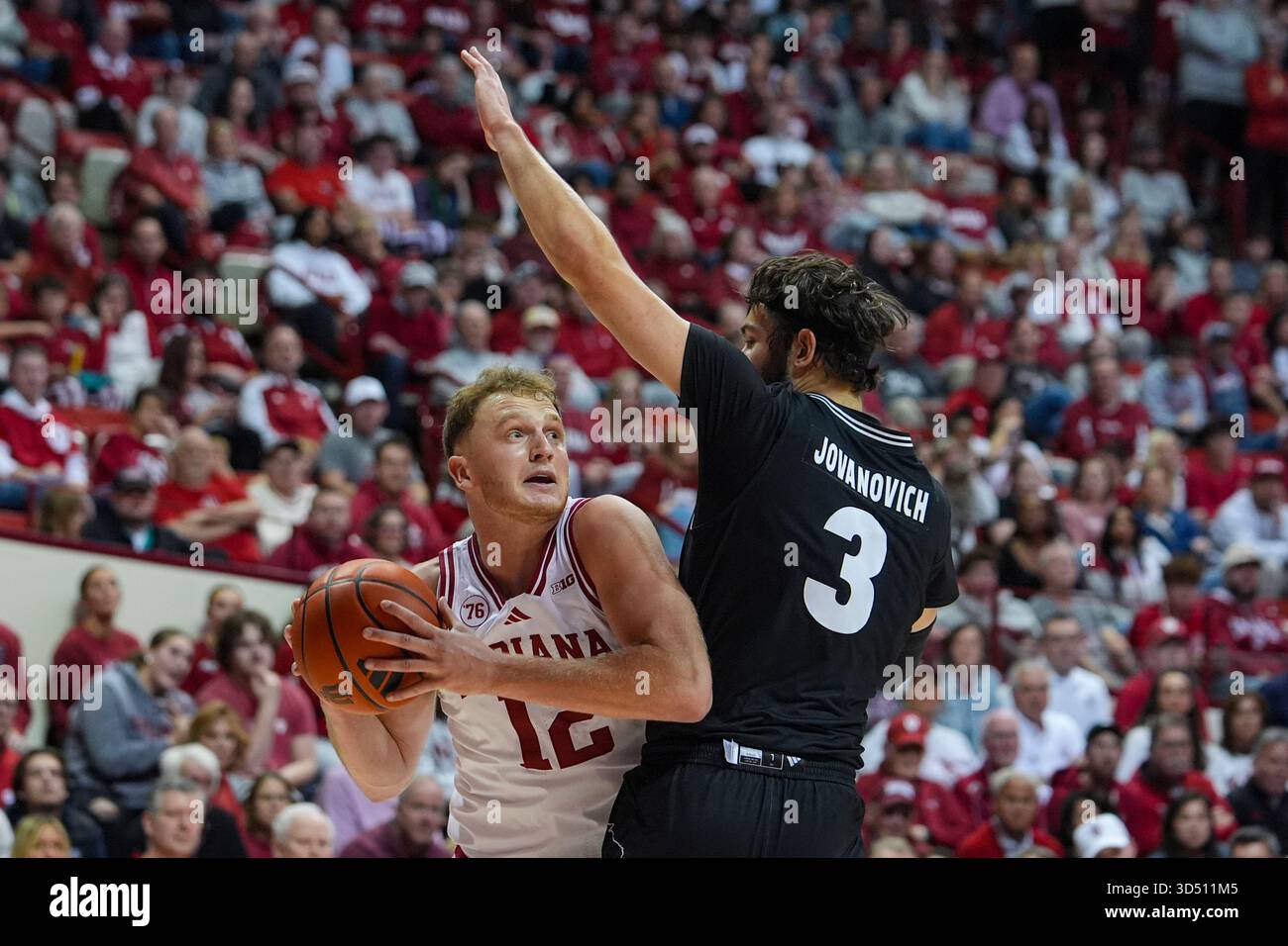 Indiana forward Tucker Devries (12) tries to get around Milwaukee ...