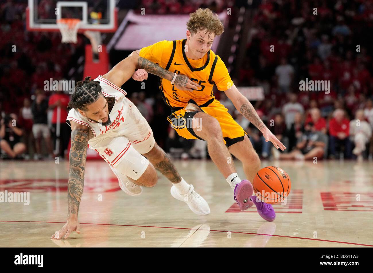 Oakland guard Brody Robinson tries to control the ball against Houston ...