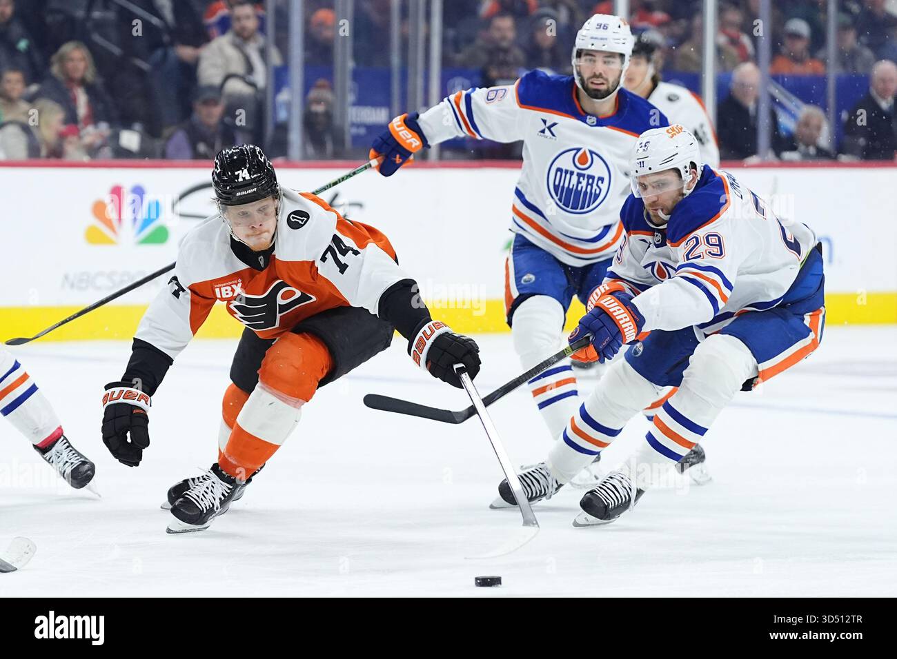 Philadelphia Flyers' Owen Tippett (74) battle for the puck with ...