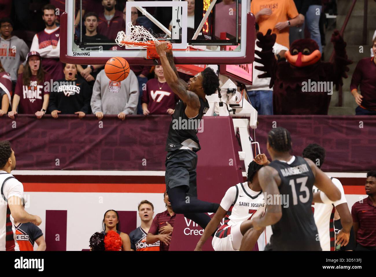 November 12, 2025: Virginia Tech Hokies forward Tobi Lawal (1) dunks ...