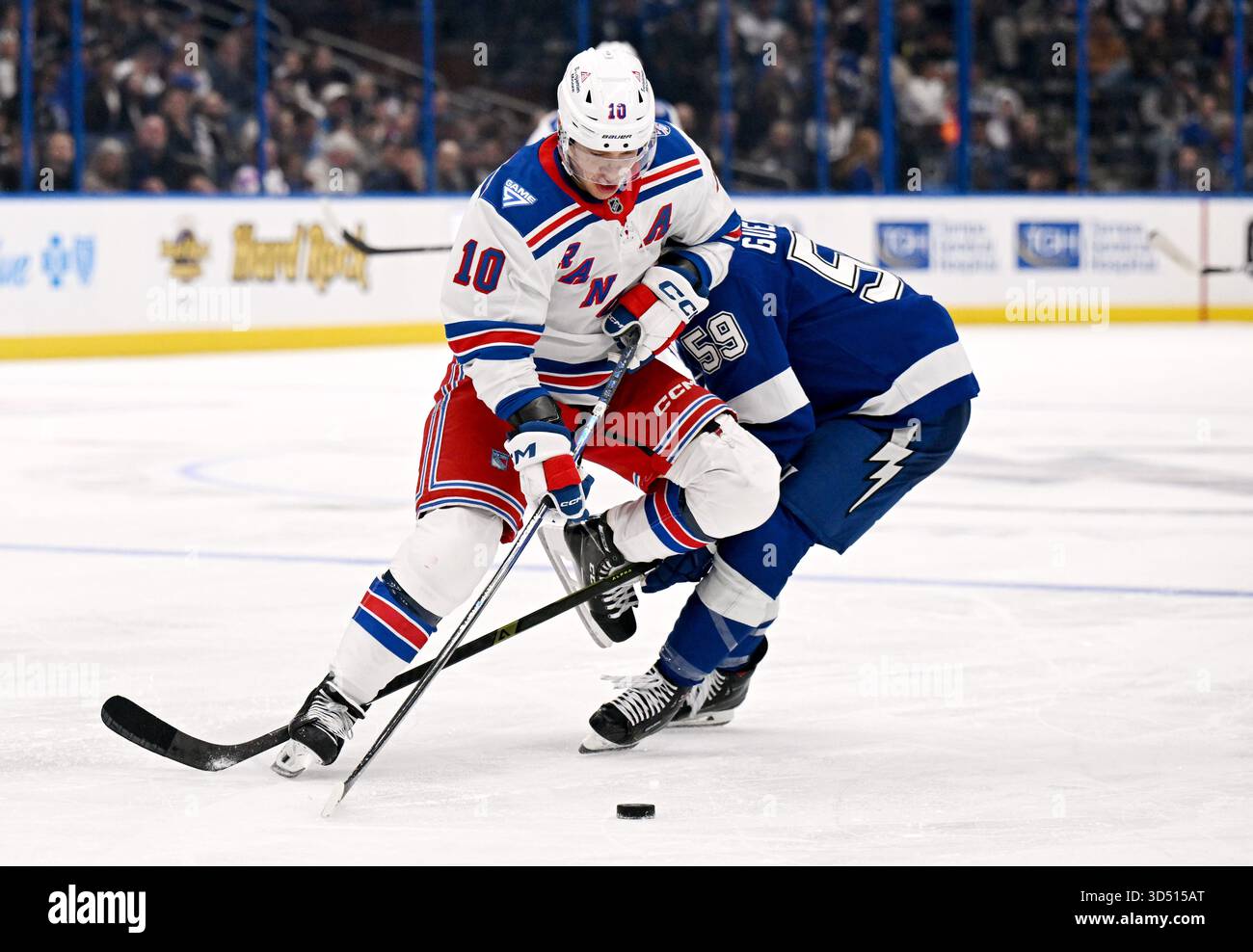 New York Rangers left wing Artemi Panarin (10) gets tangled up with ...