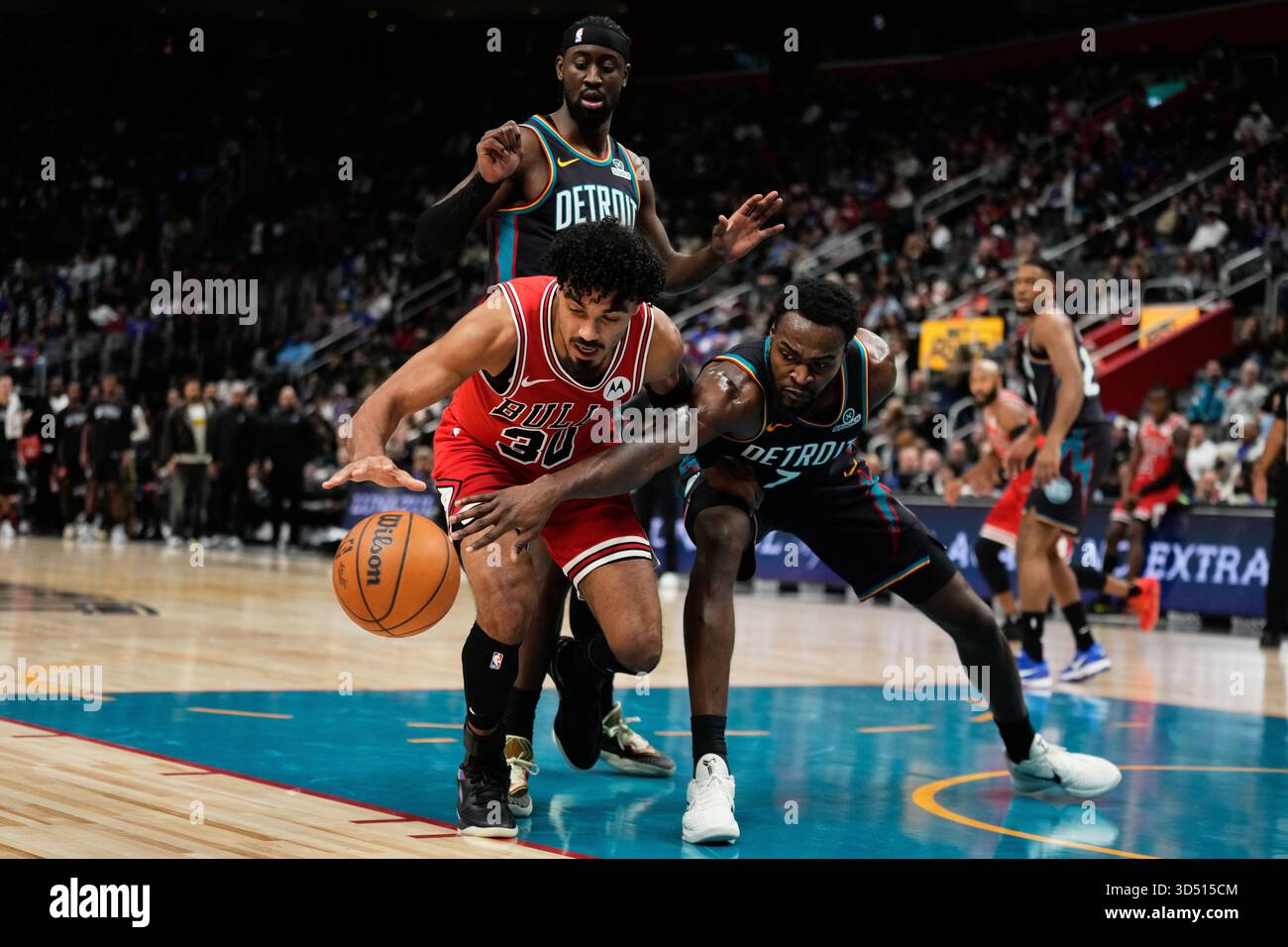 Chicago Bulls guard Tre Jones, left, vies for the ball against Detroit ...