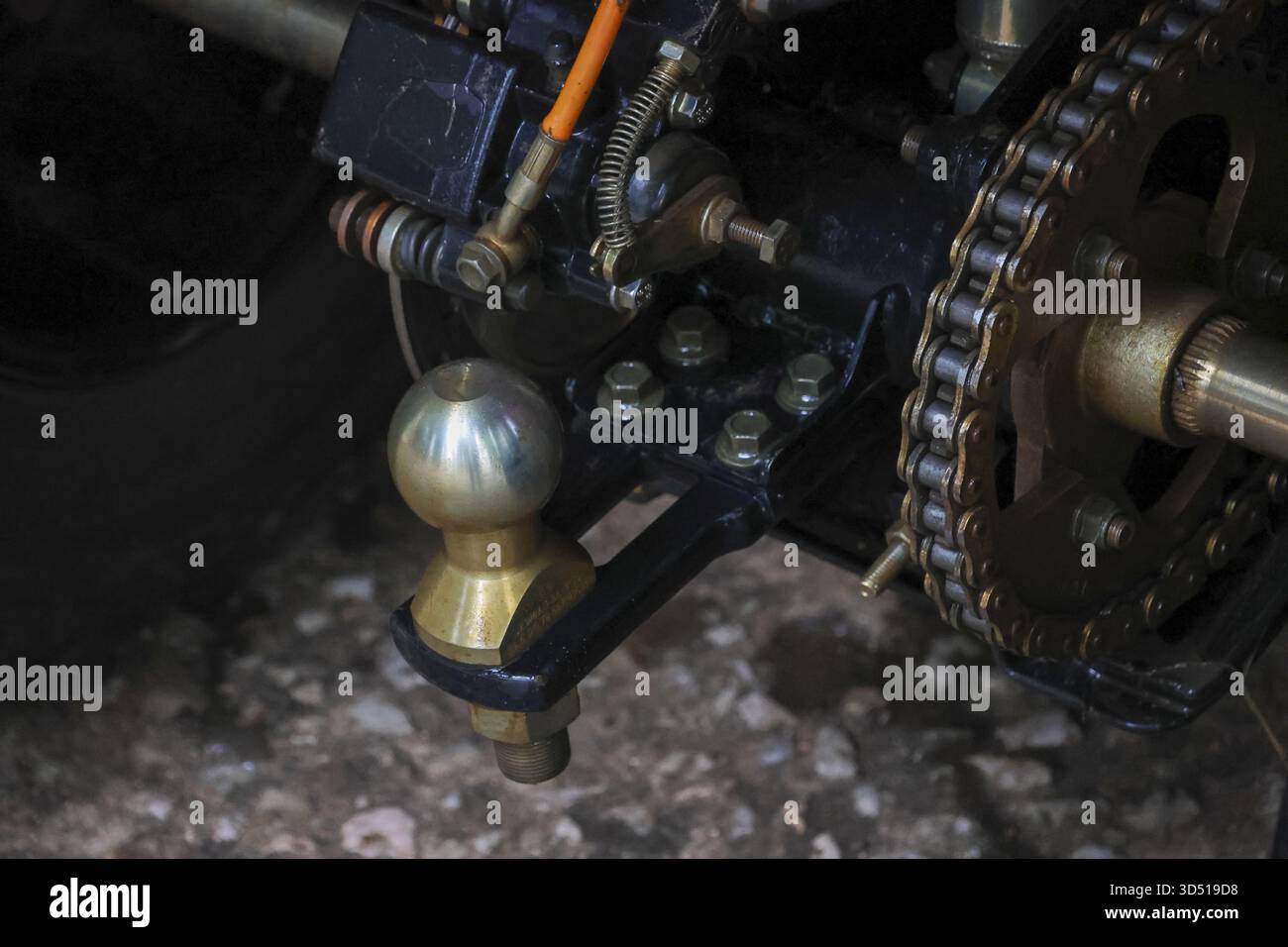 Close up view of metal tow ball and trailer hitch on back of an all ...