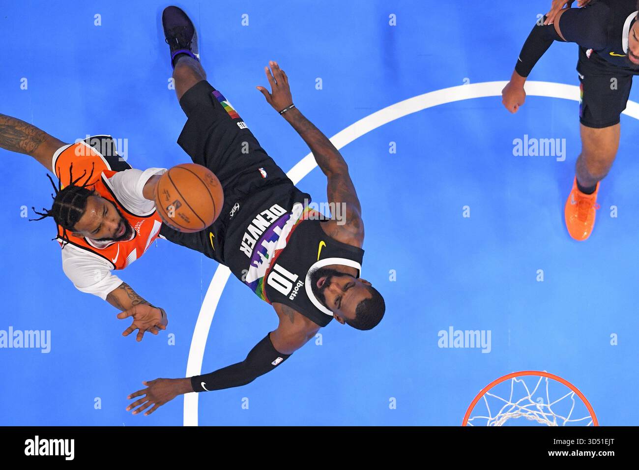Los Angeles Clippers forward Derrick Jones Jr., left, shoots as Denver ...