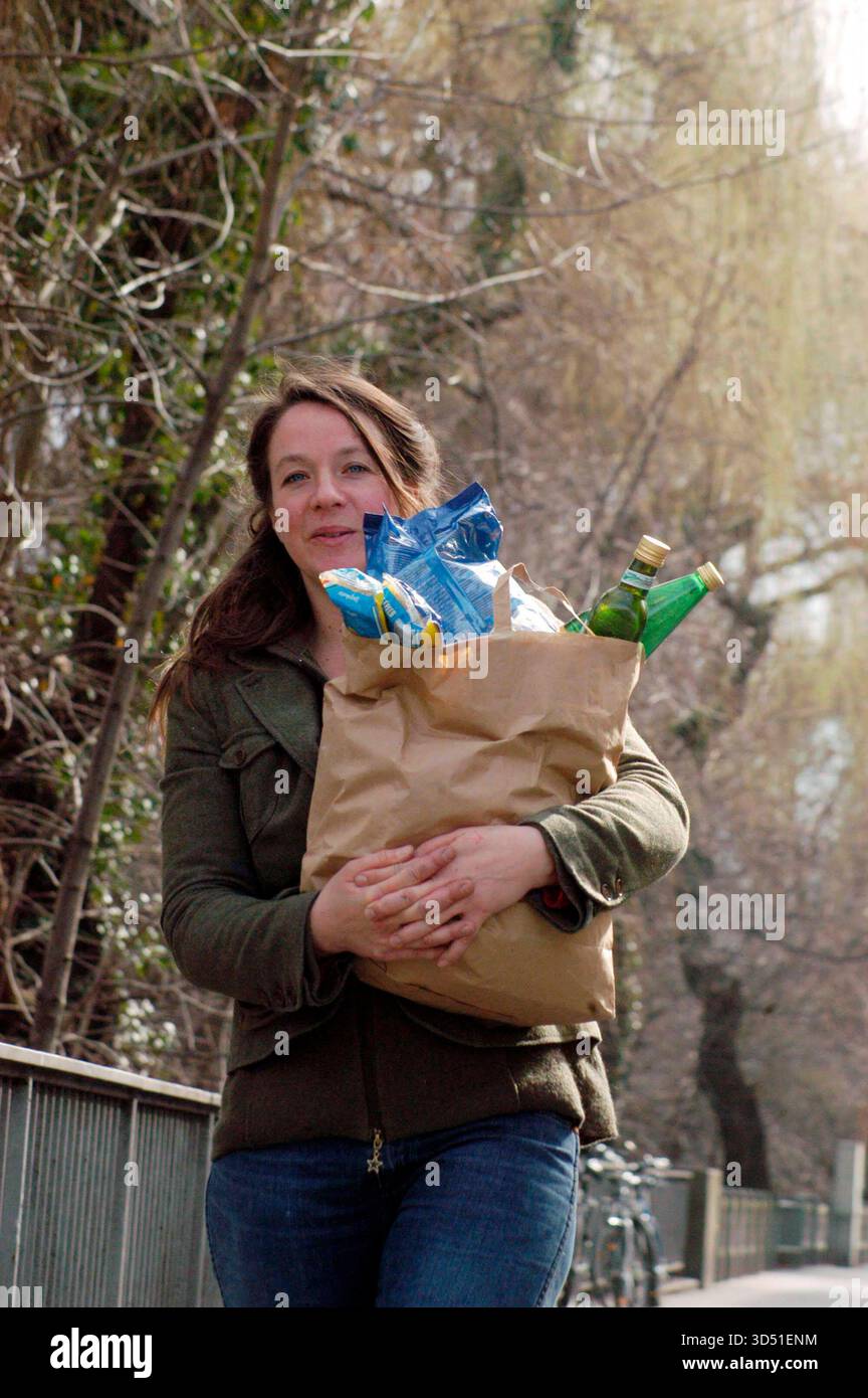 handing over a paper bag for transporting goods at the market paper bag ...