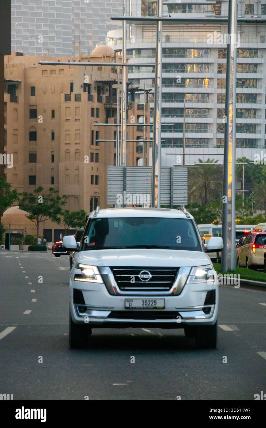 Dubai, UAE - July 13, 2024: A white Nissan Patrol Y62 SUV driving ...