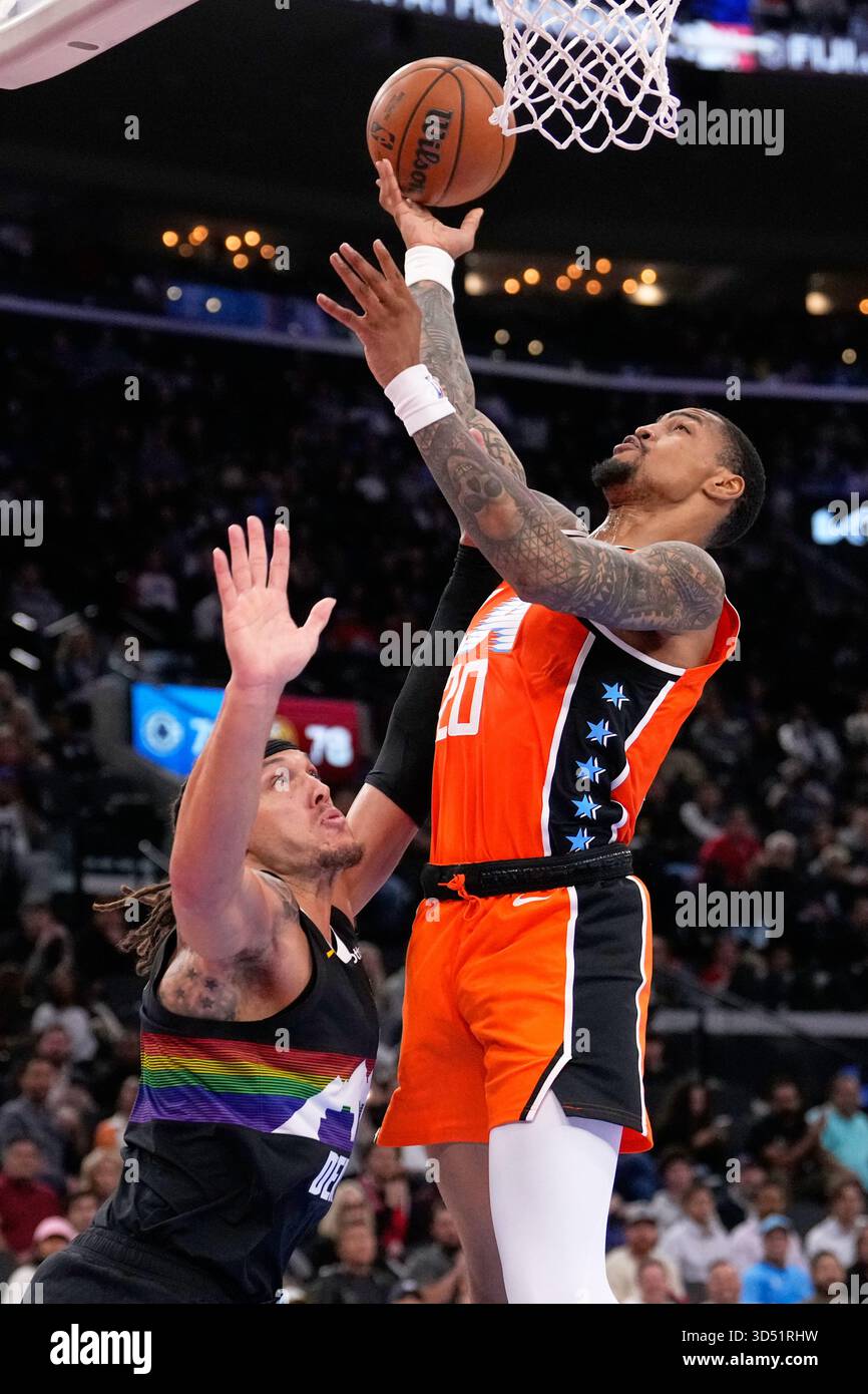 Los Angeles Clippers forward John Collins, right, shoots as Denver ...