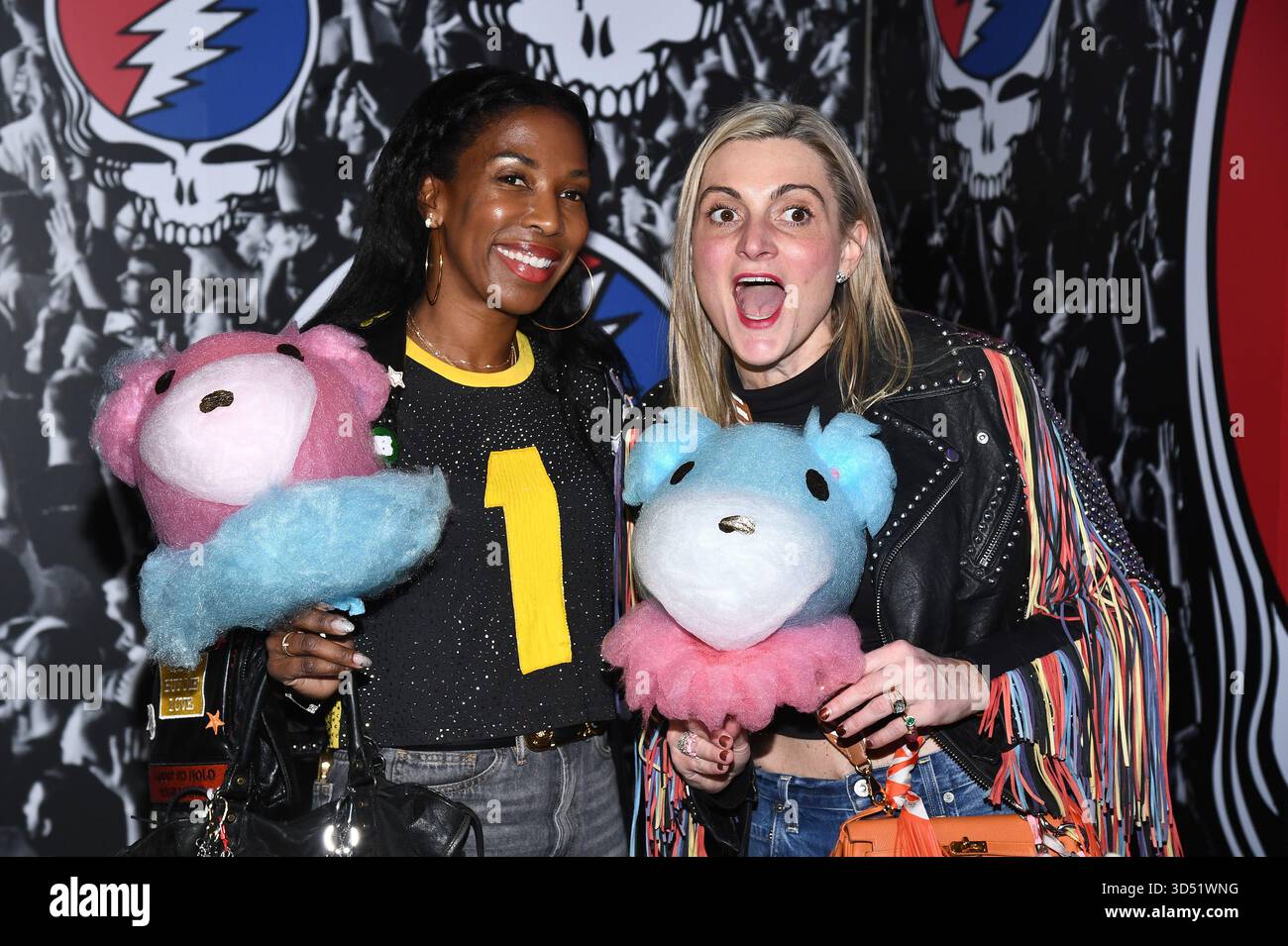 Guest pose with custom cotton candy creations at the alice & olivia by ...