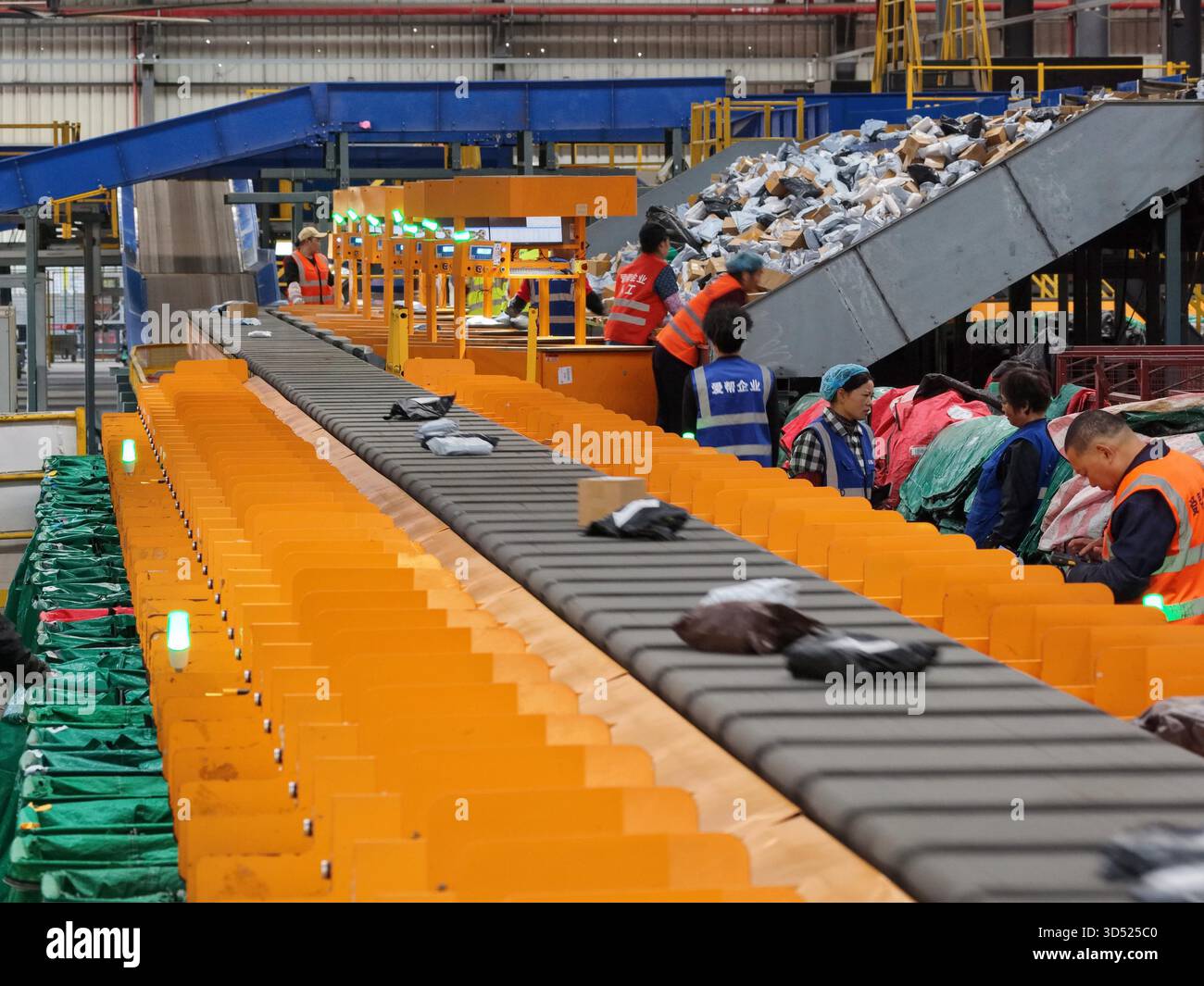 Workers sort parcels at a logistics park in Yangzhou City, east China's ...