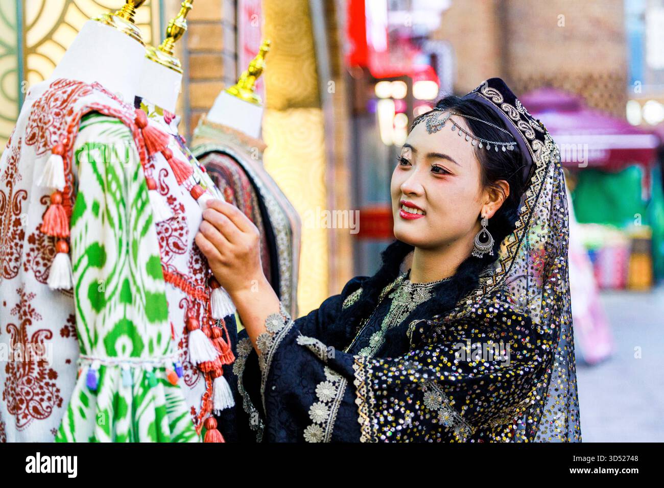 Tourists visit the Grand Bazaar in Urumqi City, northwest China's ...