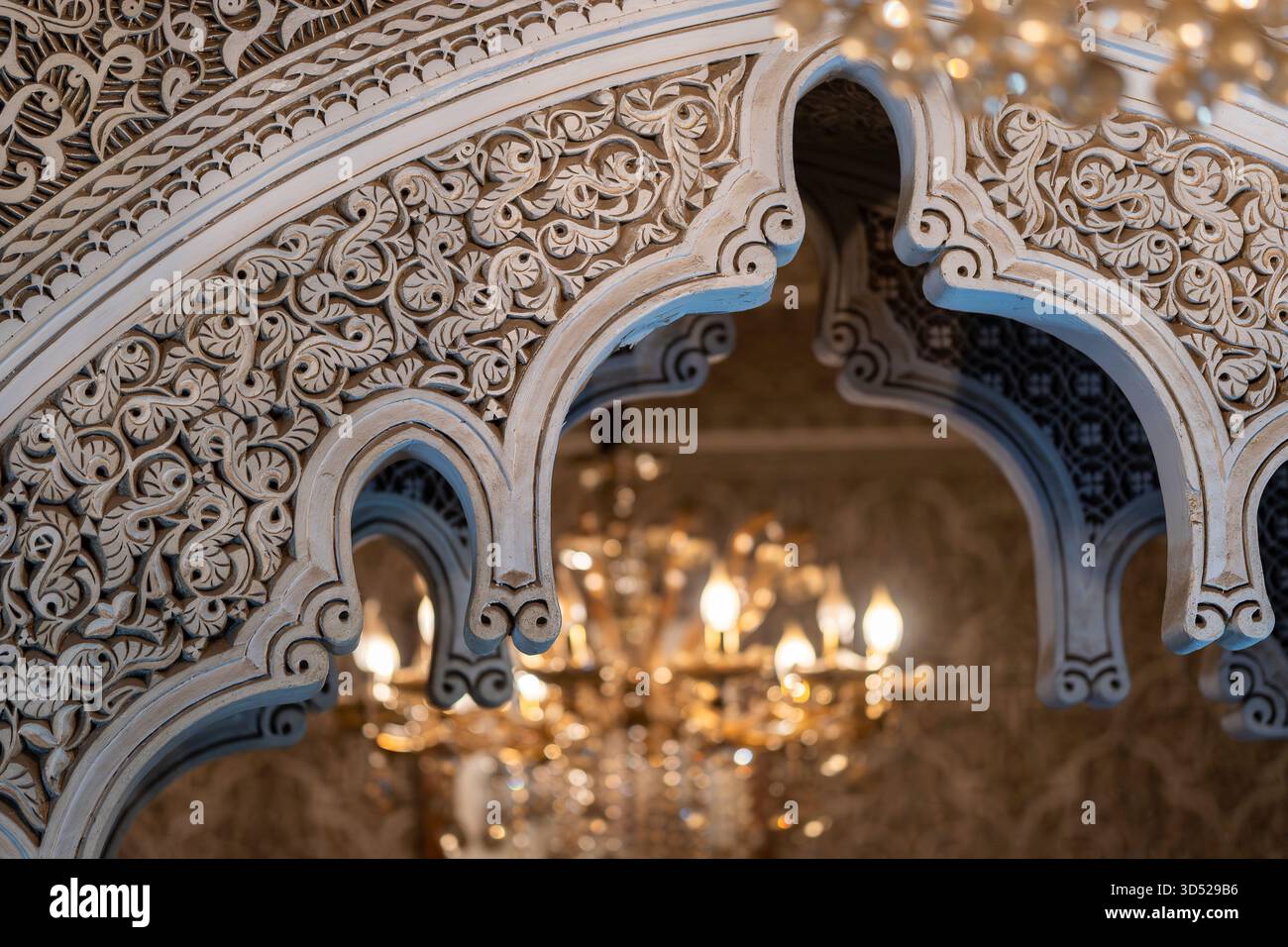 Ornate Moroccan arches with intricate stucco patterns. Close-up of ...