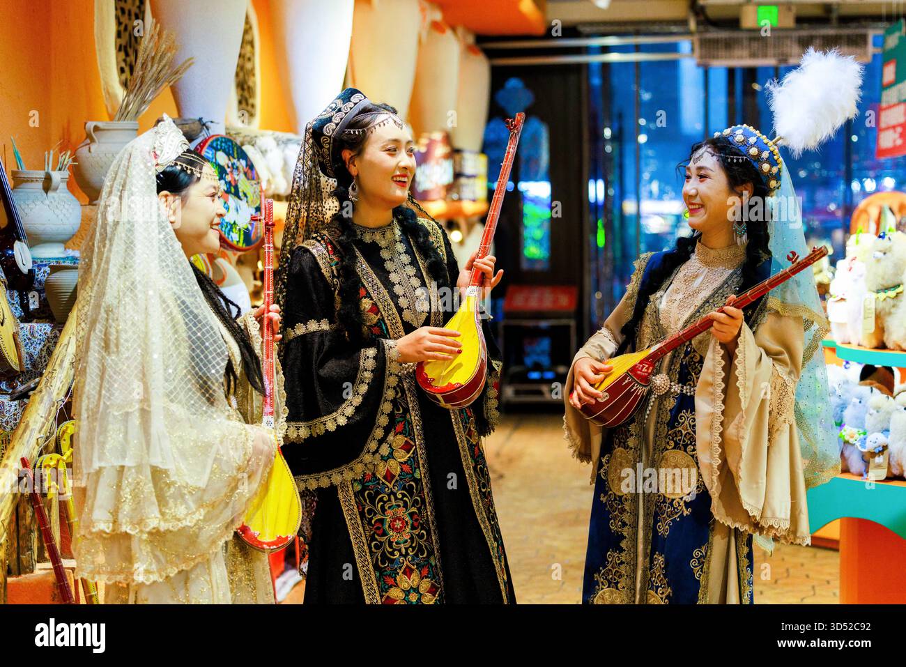Tourists visit the Grand Bazaar in Urumqi City, northwest China's ...