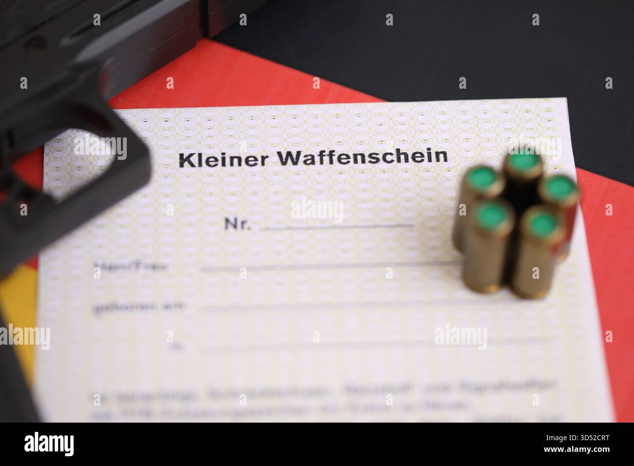 German light firearms license and handgun with bullets on Germany flag ...