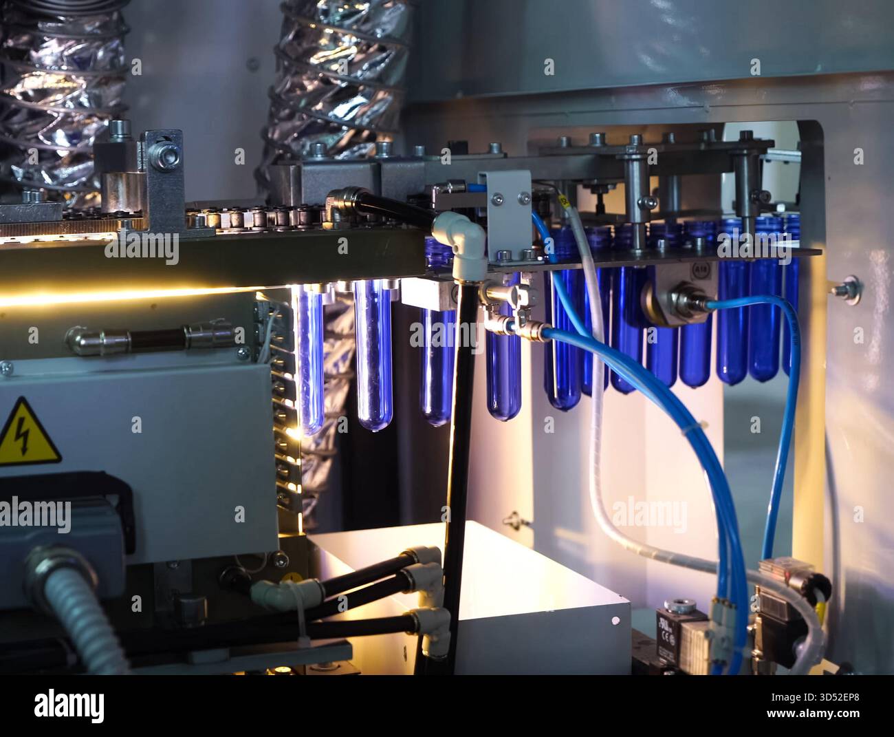 Filling line in plastic flasks. Liquid Filling Plant Stock Photo - Alamy