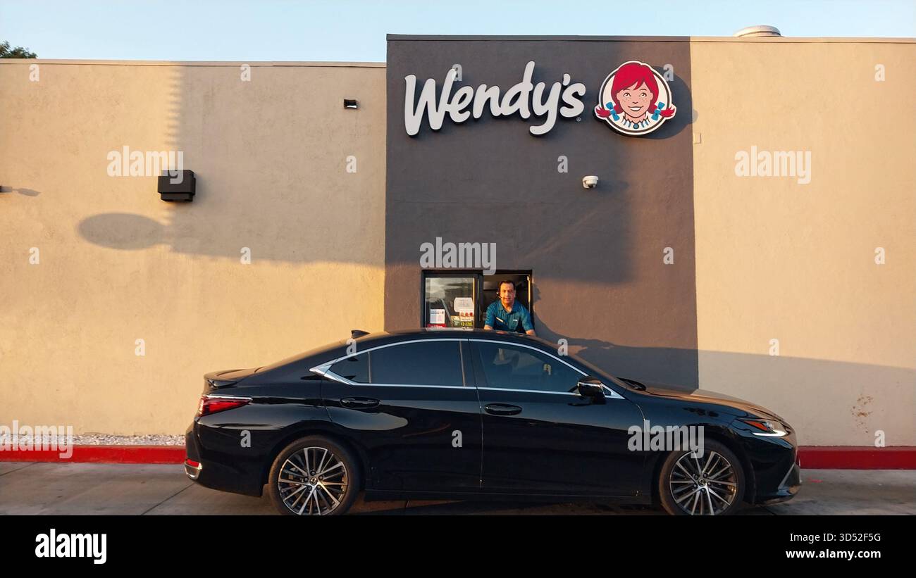 Wendy's Hamburger Restaurant drive thru pick up window Stock Photo - Alamy