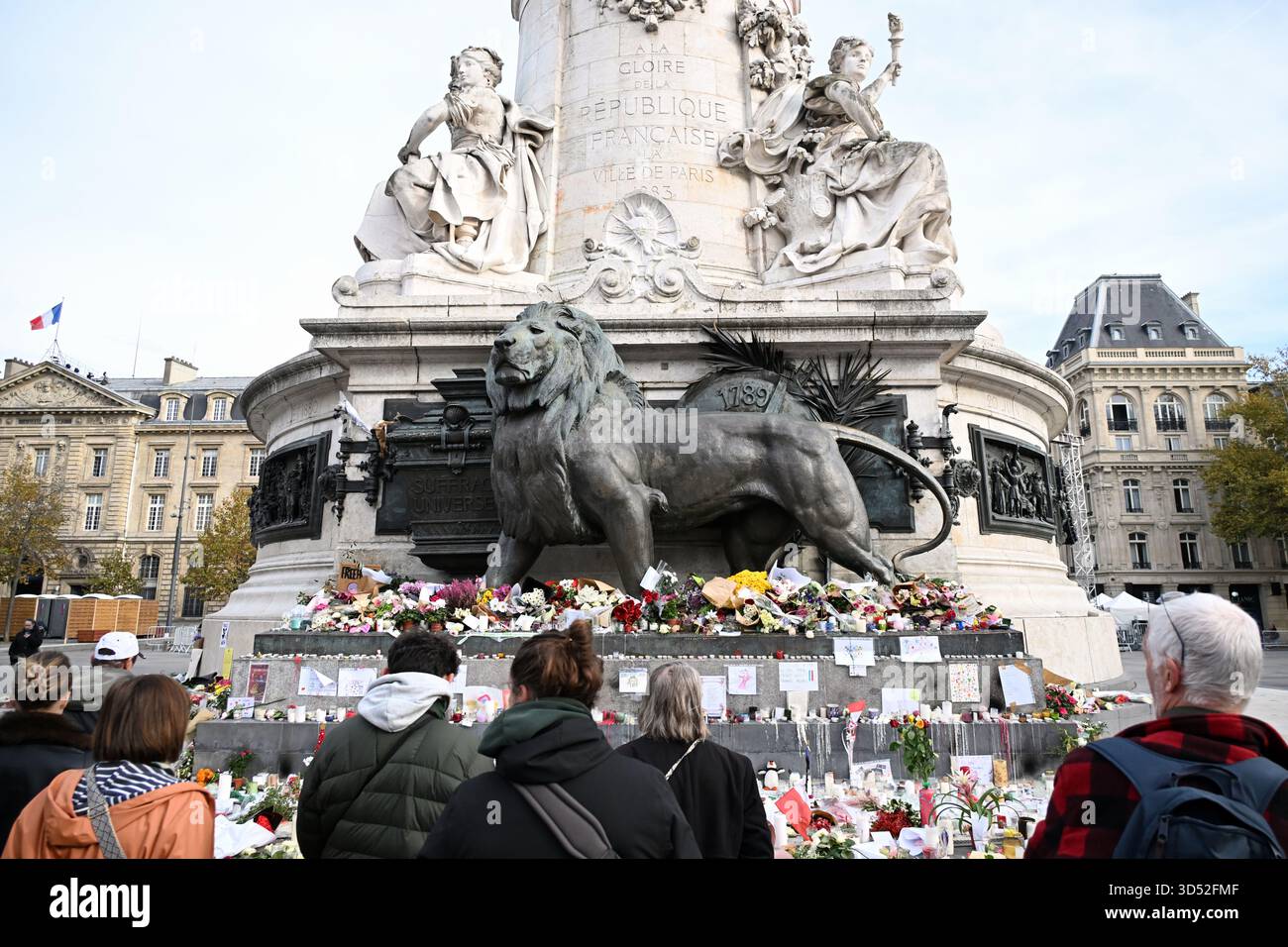 People stand by the statue of the Place de la Republique (Republic ...